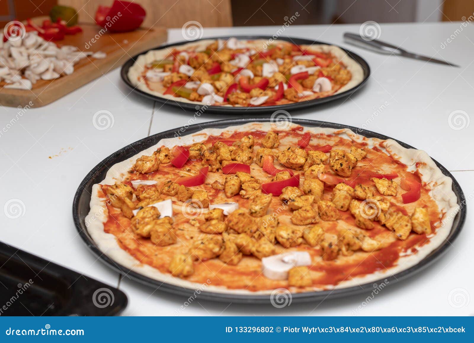 Preparation of a Delicious Pizza in a Home Kitchen. Laying and D Stock ...