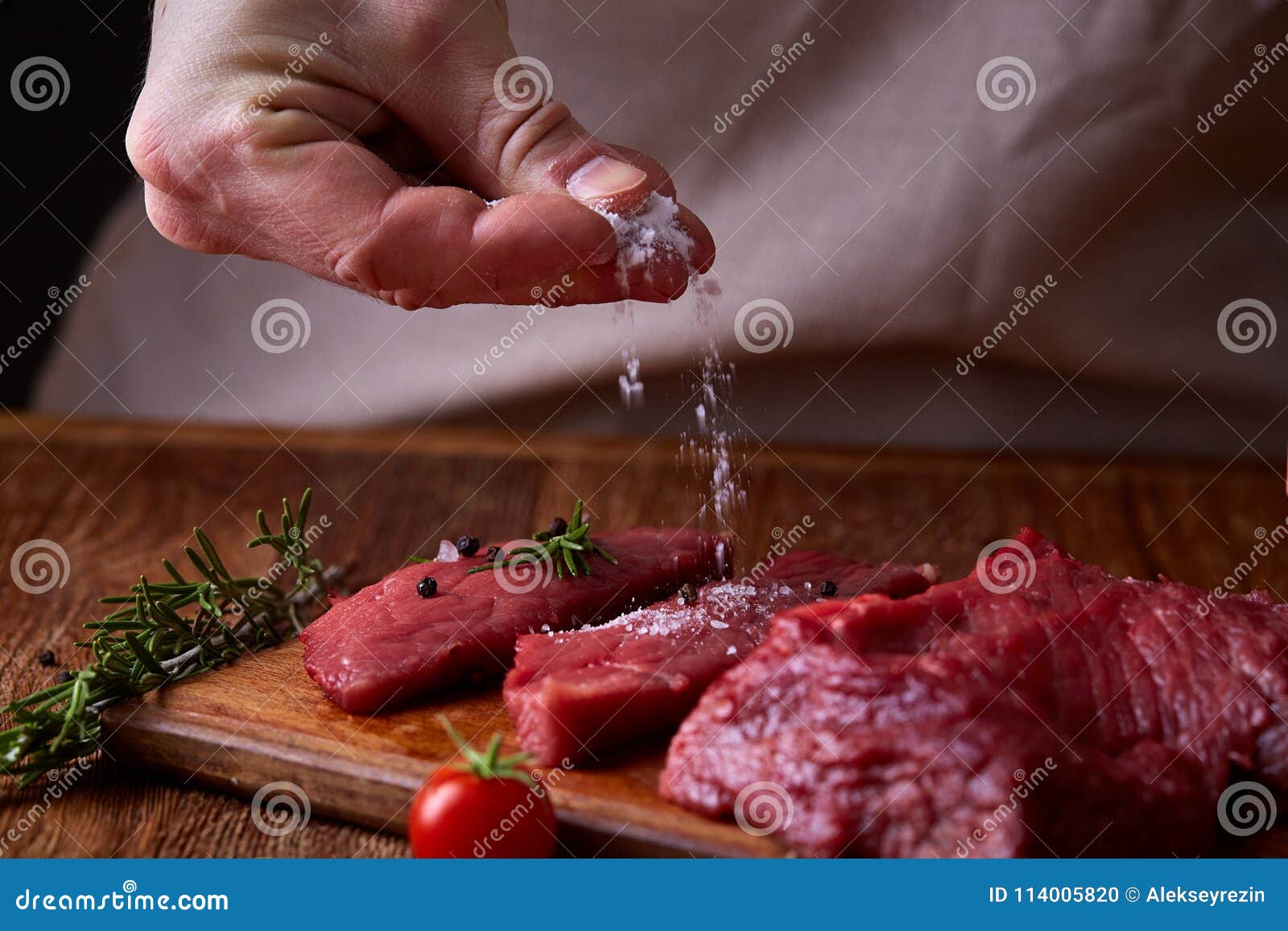 Strong Professional Man`s Hands Spilling Salt on Raw Beefsteak ...