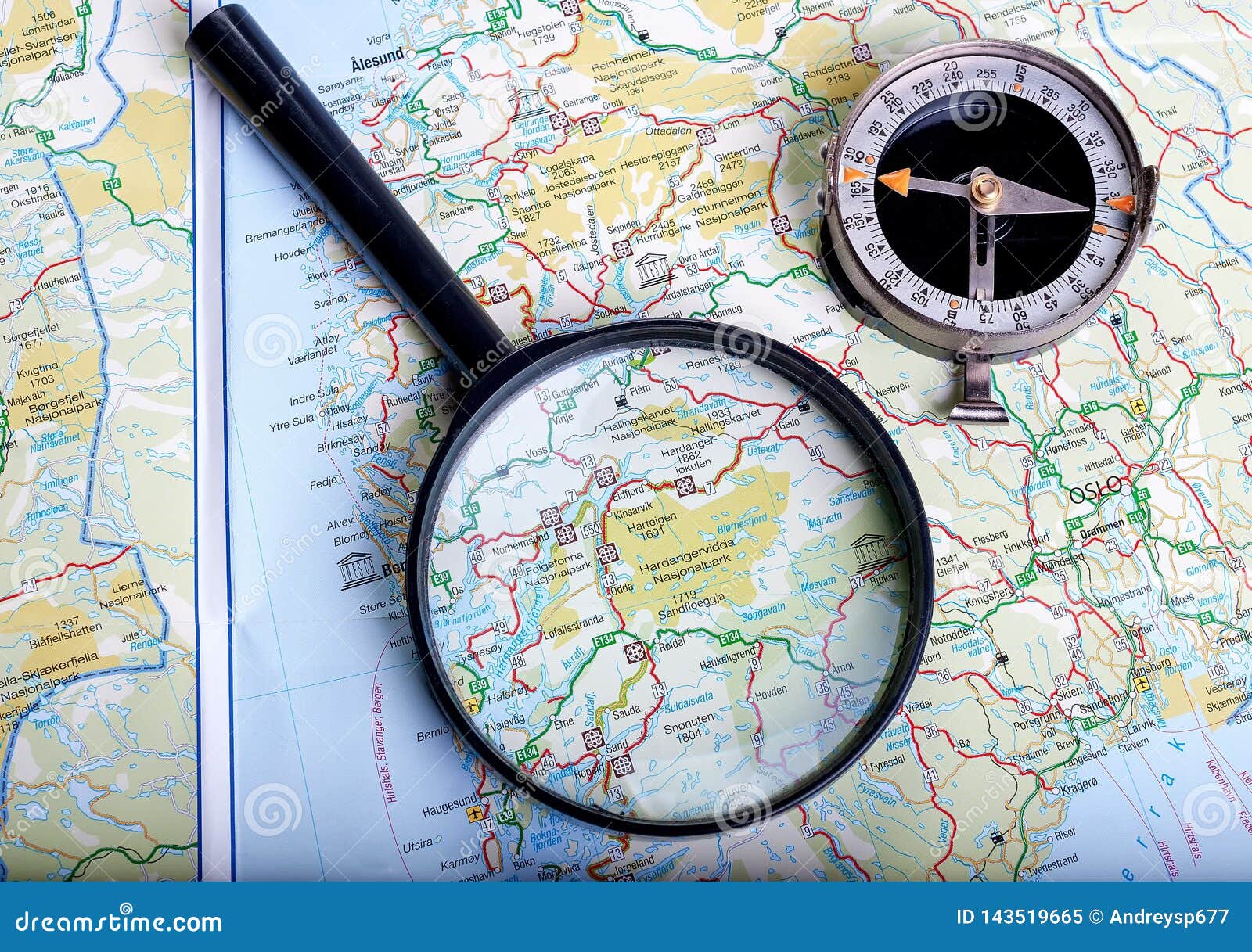 Preparation for the Journey. a Map with a Compass and a Magnifying ...