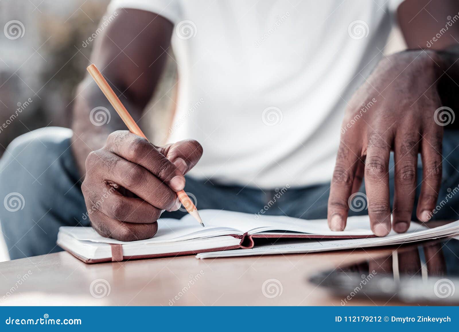 Close Up of African American Man Taking Notes Stock Photo - Image of ...