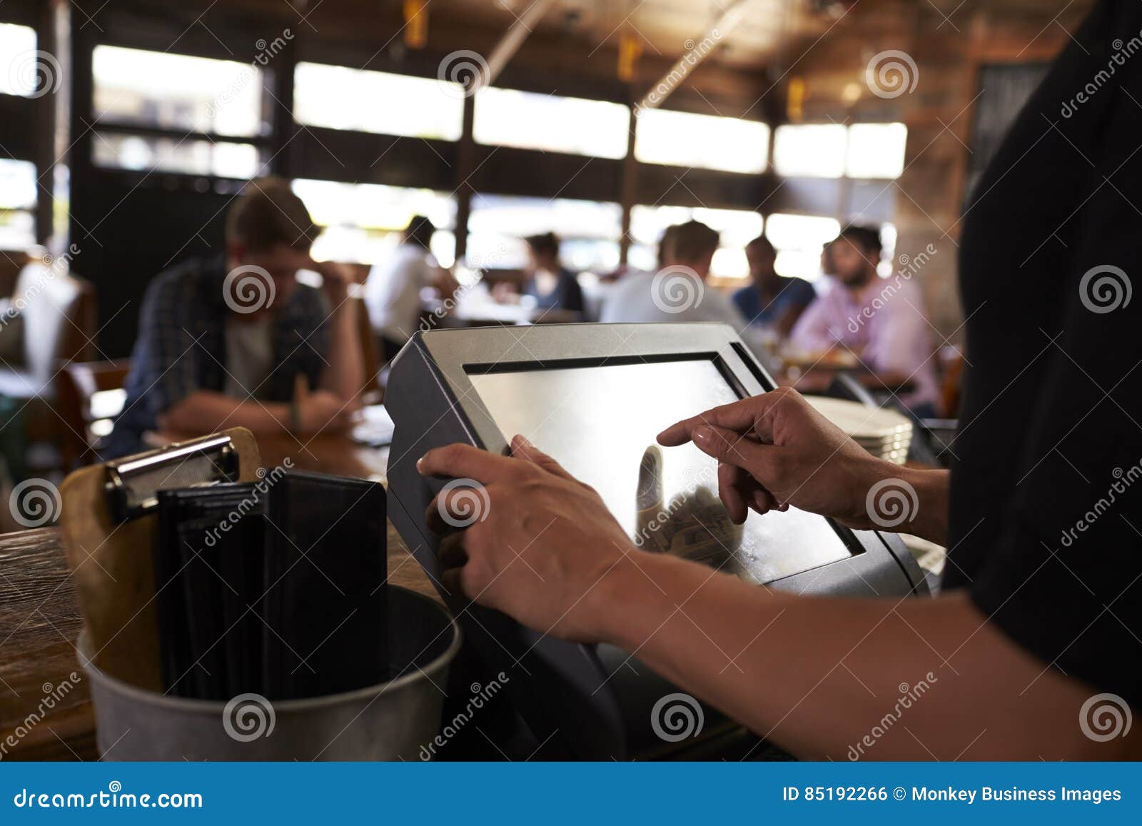 Preparing the Bill at a Restaurant Using a Touch Screen Till Stock ...