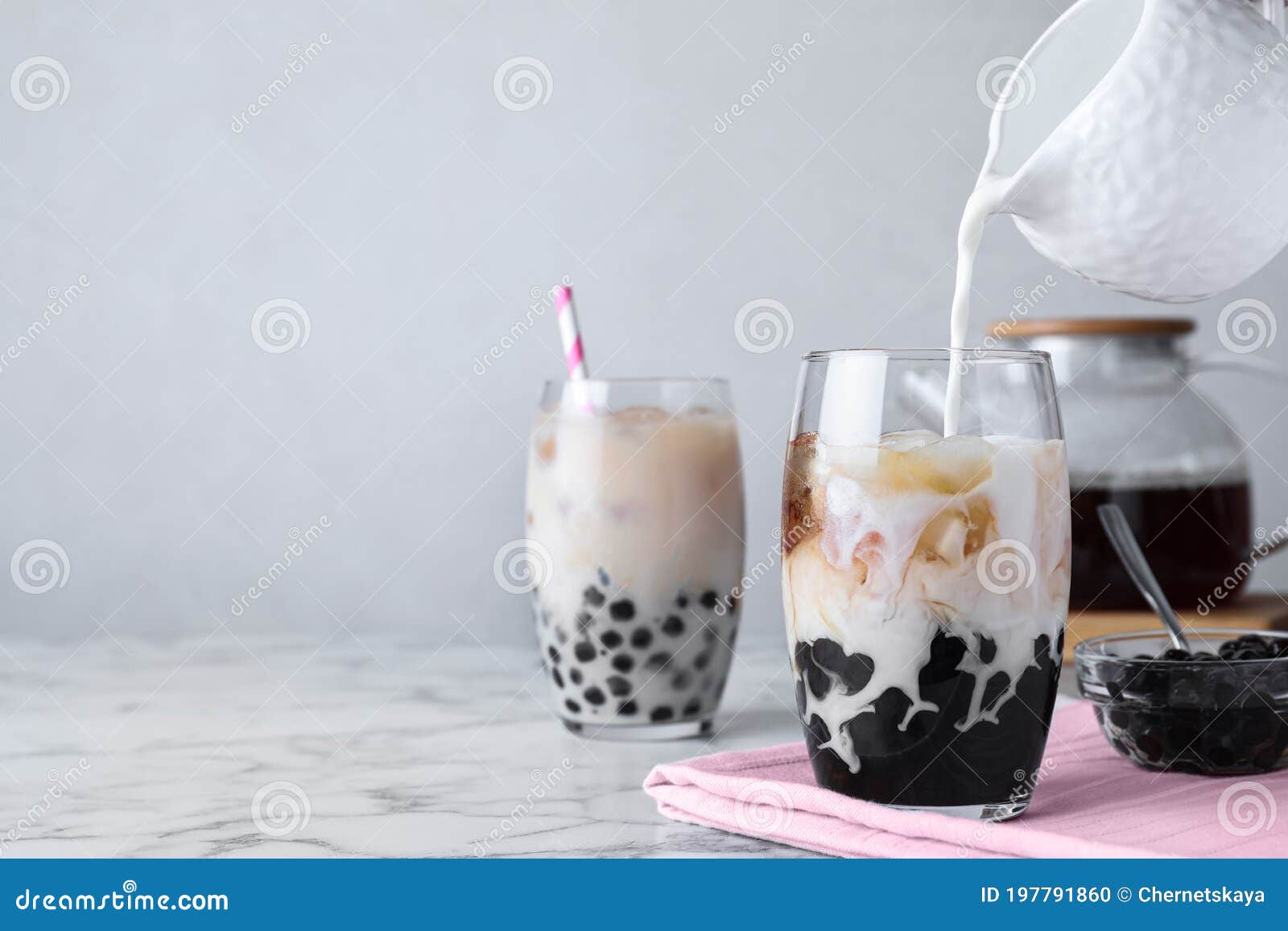 Preparing Bubble Milk Tea with Tapioca Balls on White Marble Table ...