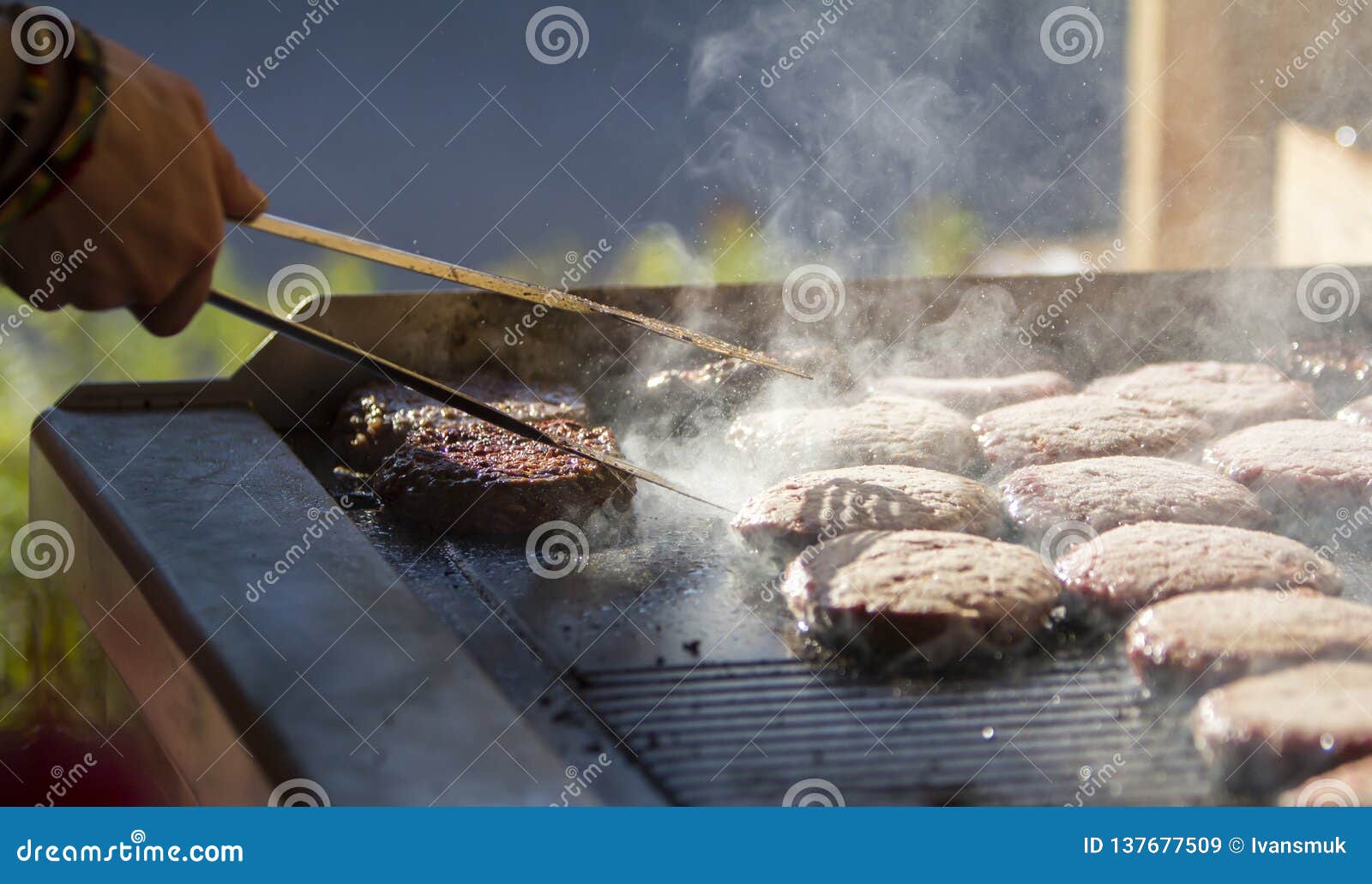 Preparing Burgers at the Barbecue Outdoors Stock Image - Image of dogs ...