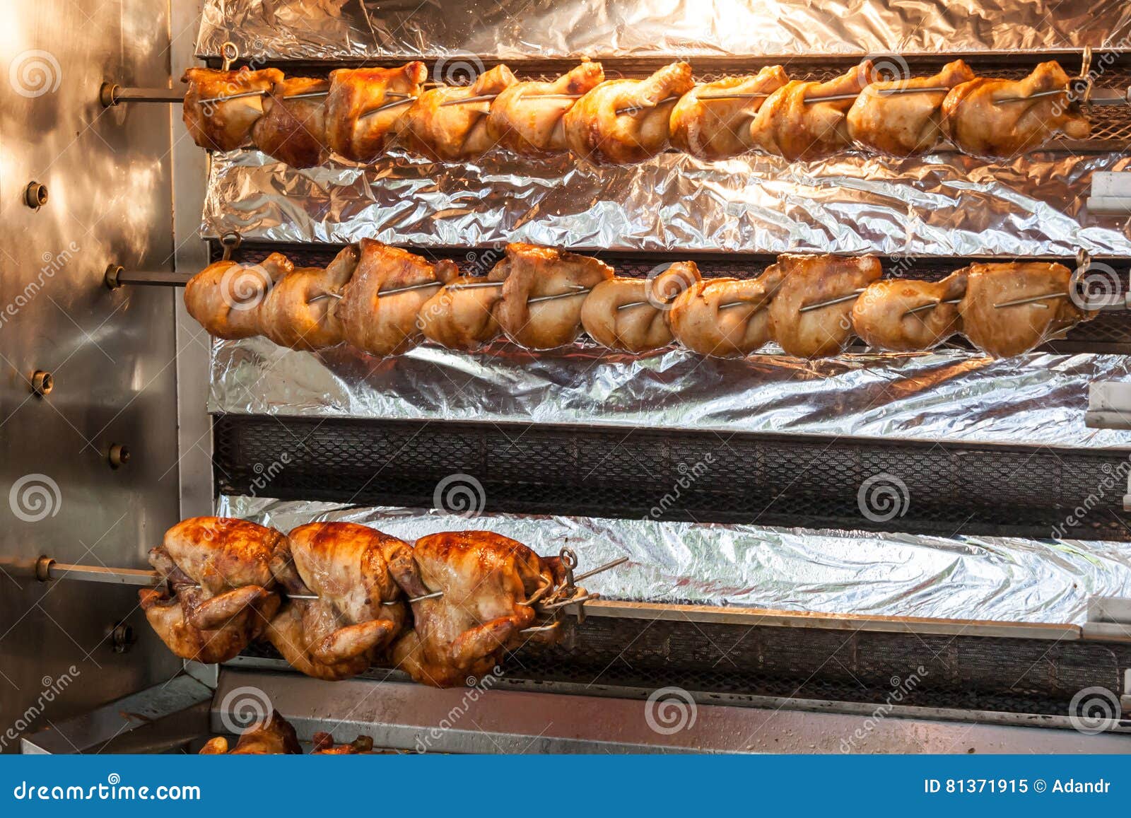 The Preparing Chicken Grill on a Spit in an Oven Stock Image - Image of ...