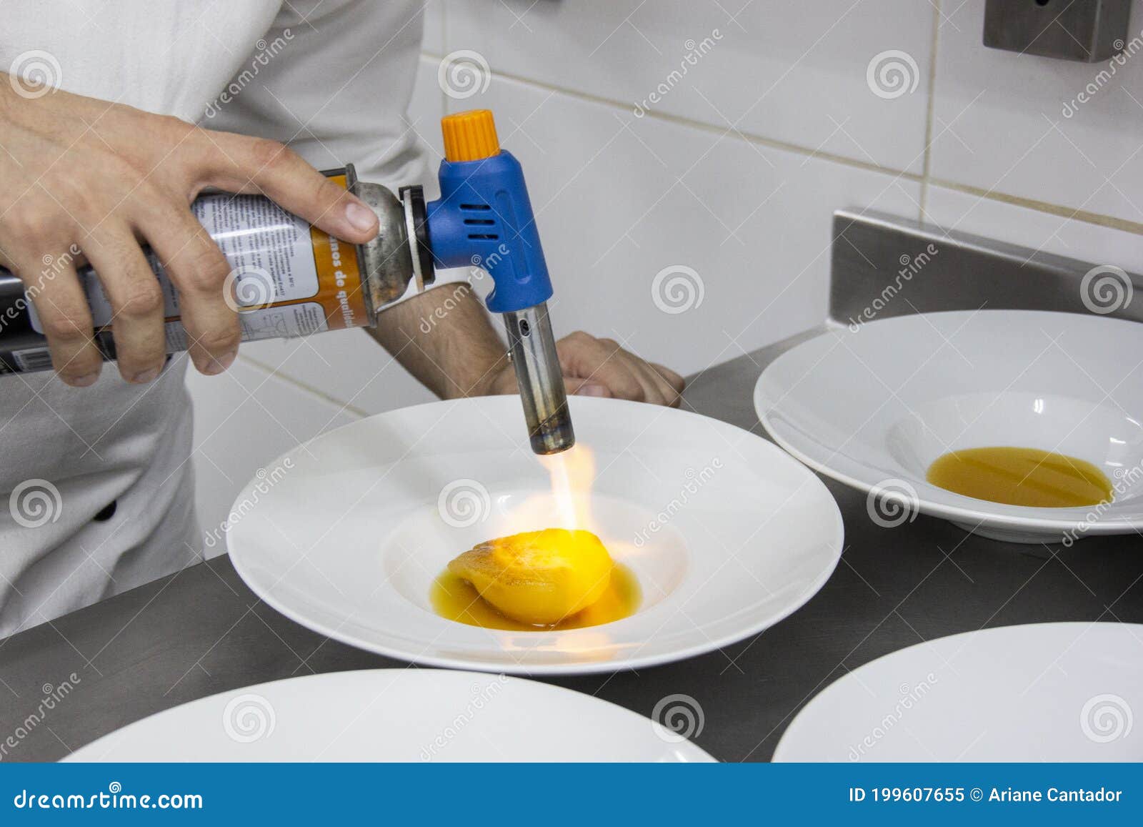 Preparing Dessert of Pear Brulee with Dolce Gorgonzola Cheese Stock ...