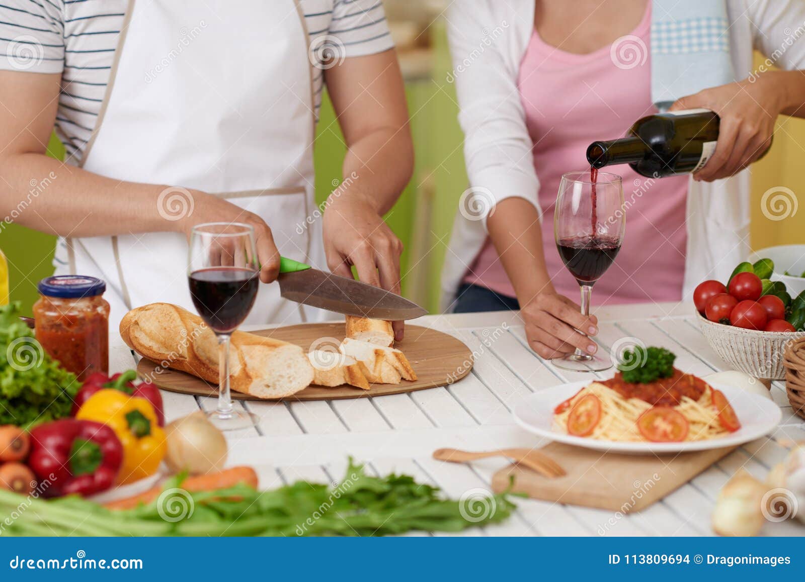 Preparing dinner table stock photo. Image of cutting - 113809694
