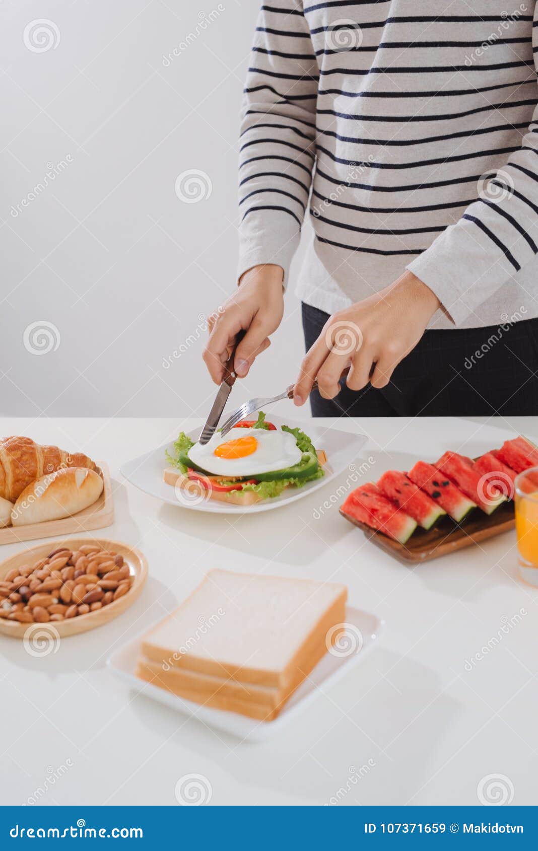 Preparing and Eating Breakfast at Home in Morning. Stock Image - Image ...