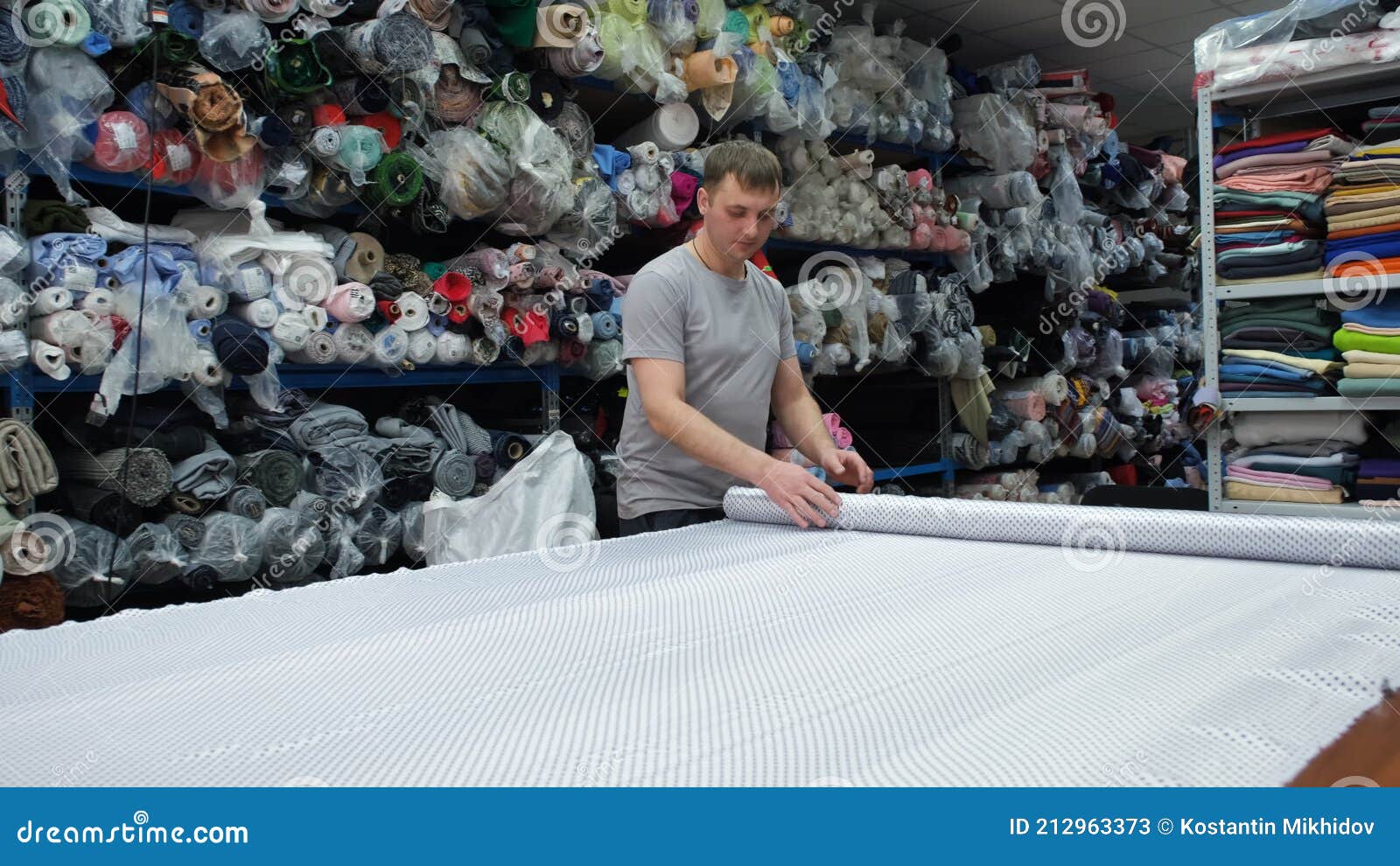 Preparing Fabric for Cutting in a Textile Store Stock Video - Video of ...