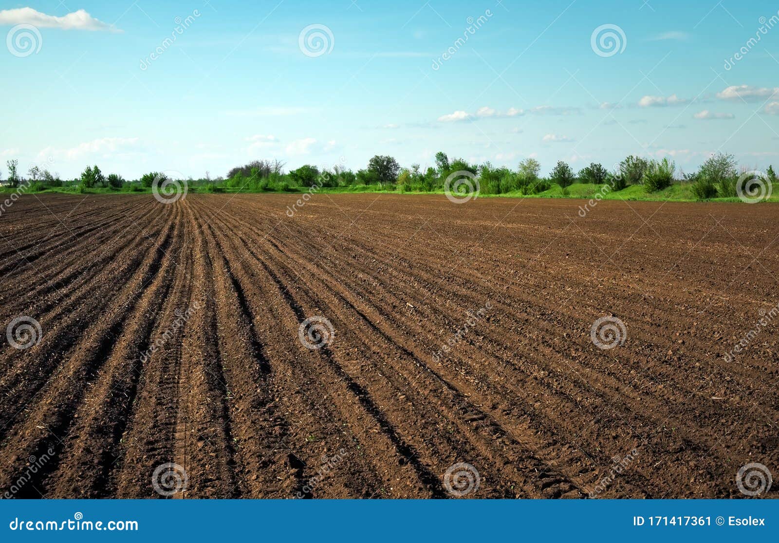 Preparing Field for Planting. Plowed Soil in Spring Time with Two Tubes ...