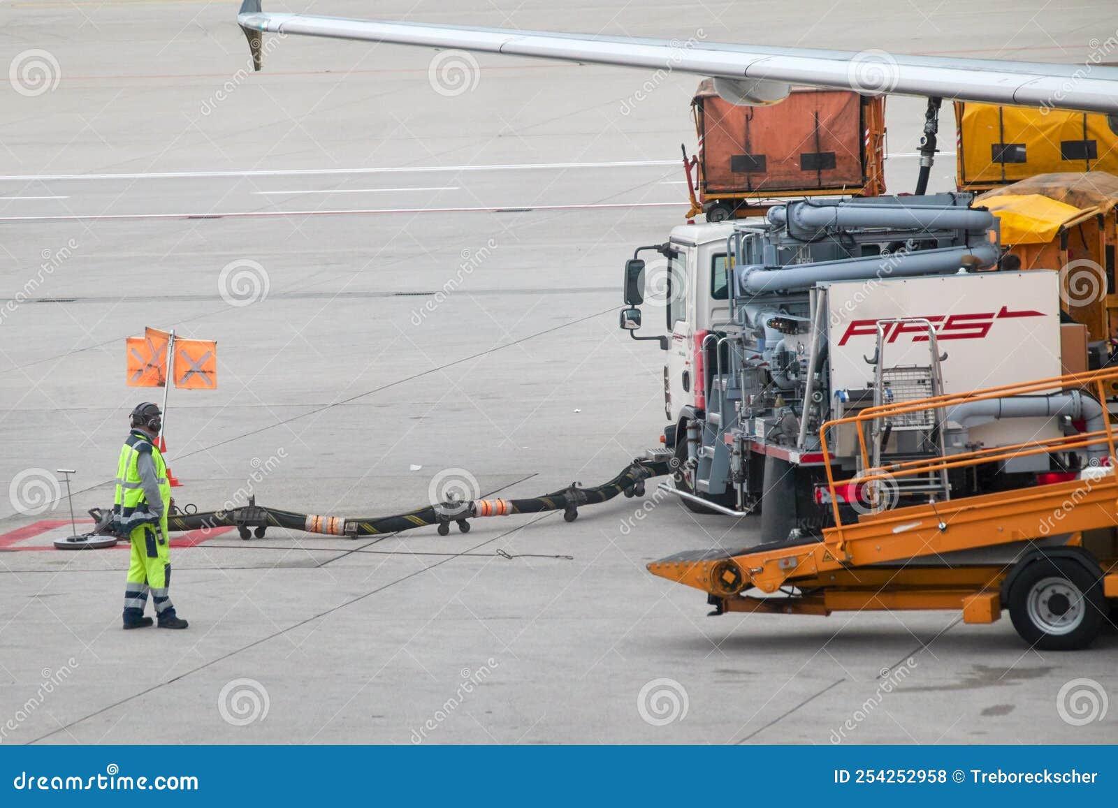 Preparing for the Flight. Working on the Tarmac or Apron of an Airport ...