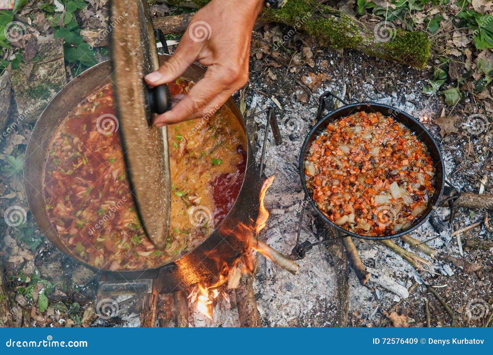 Preparing food on campfire stock image. Image of heat - 72576409