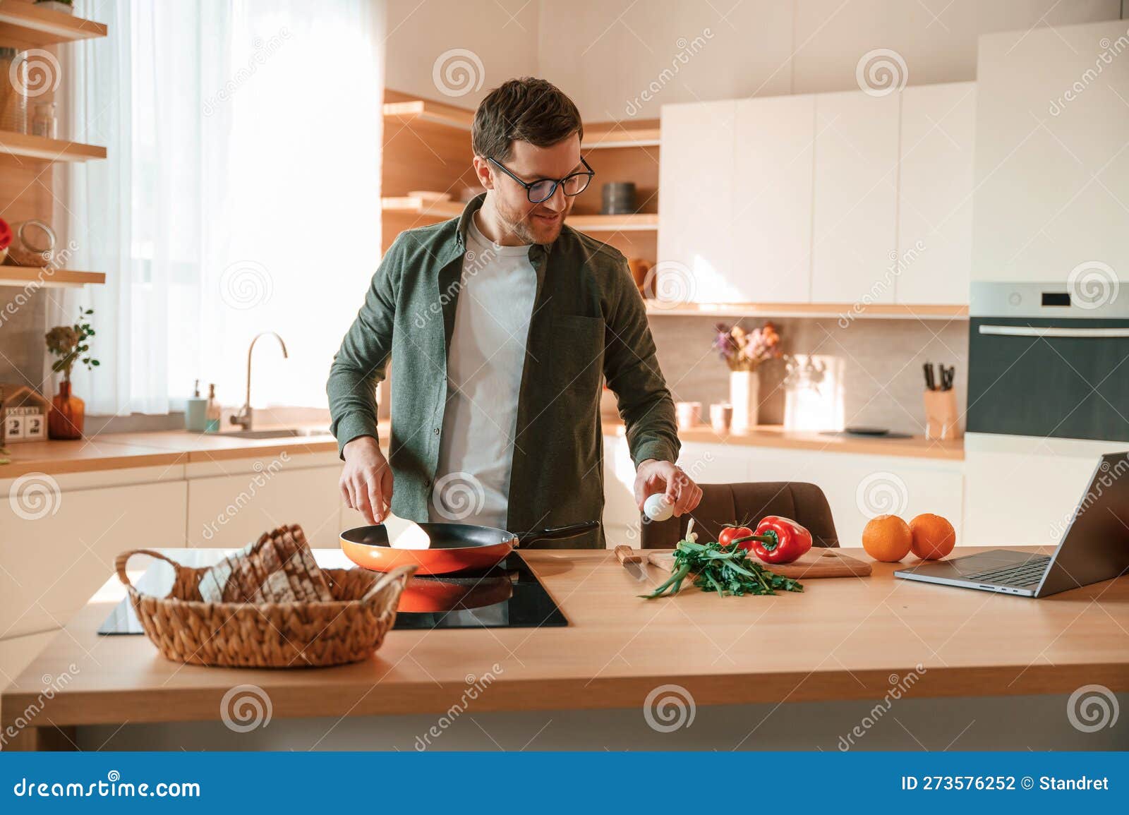 Preparing the Food. Handsome Man is on the Kitchen at Daytime Stock ...