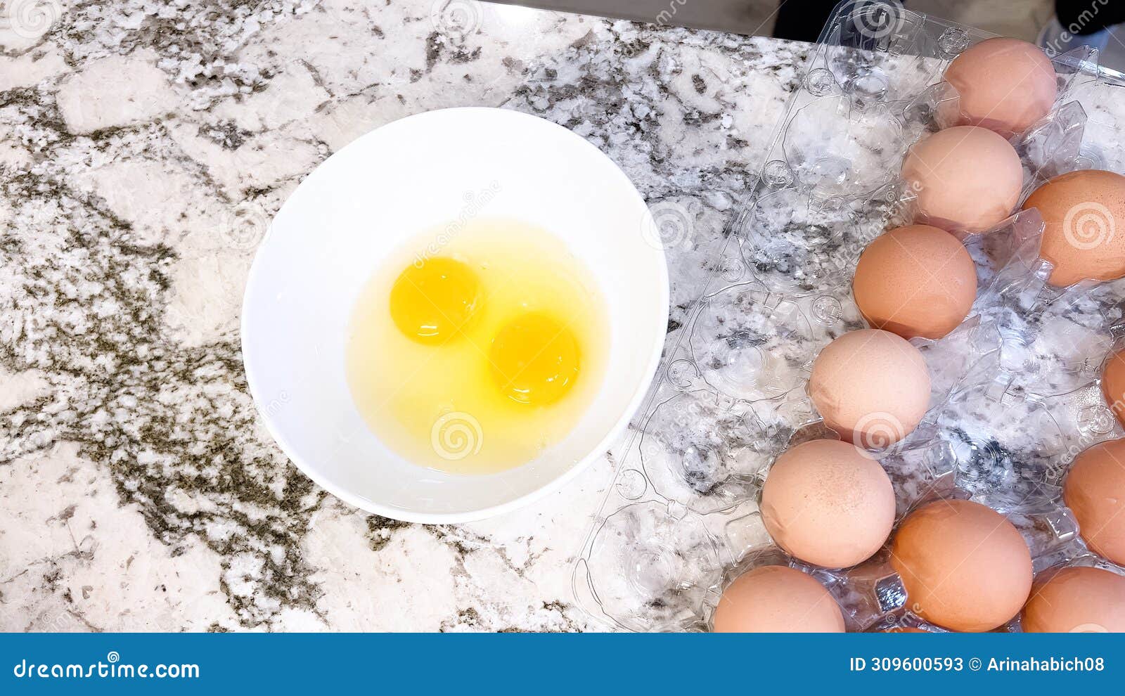 Preparing Fresh Eggs for Cooking on a Marble Kitchen Countertop Stock ...