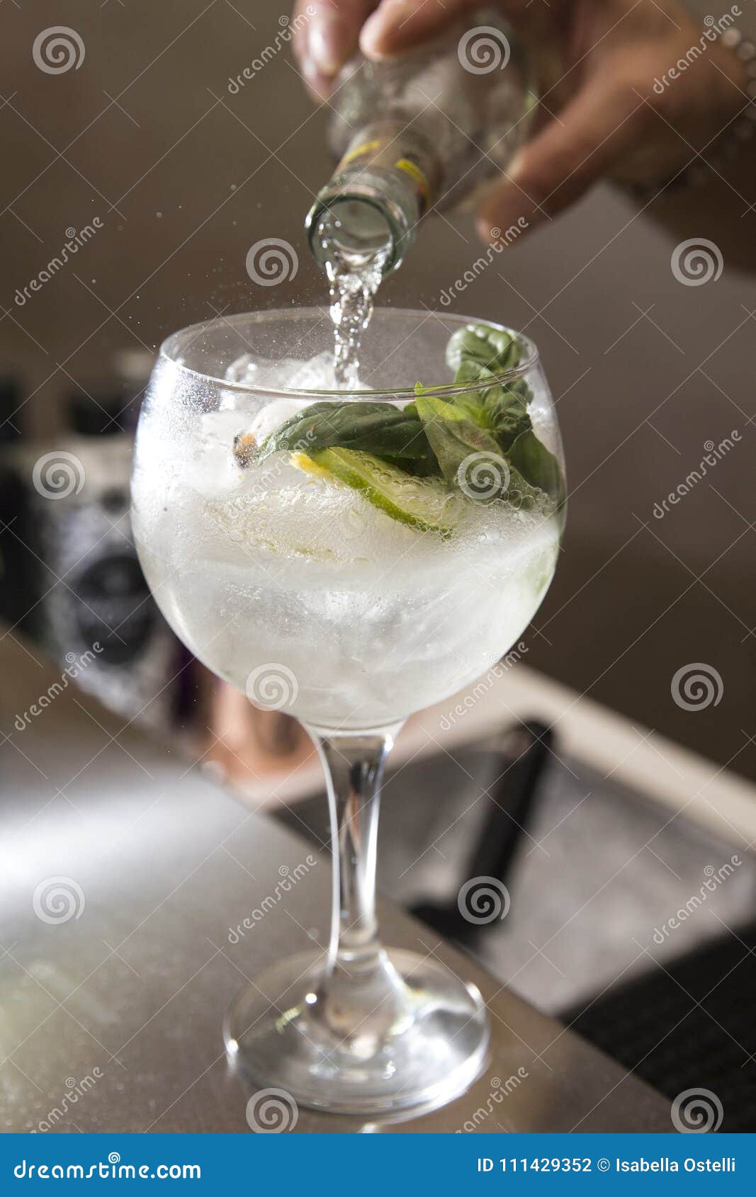 Pouring tonic water stock photo. Image of illuminated - 111429352