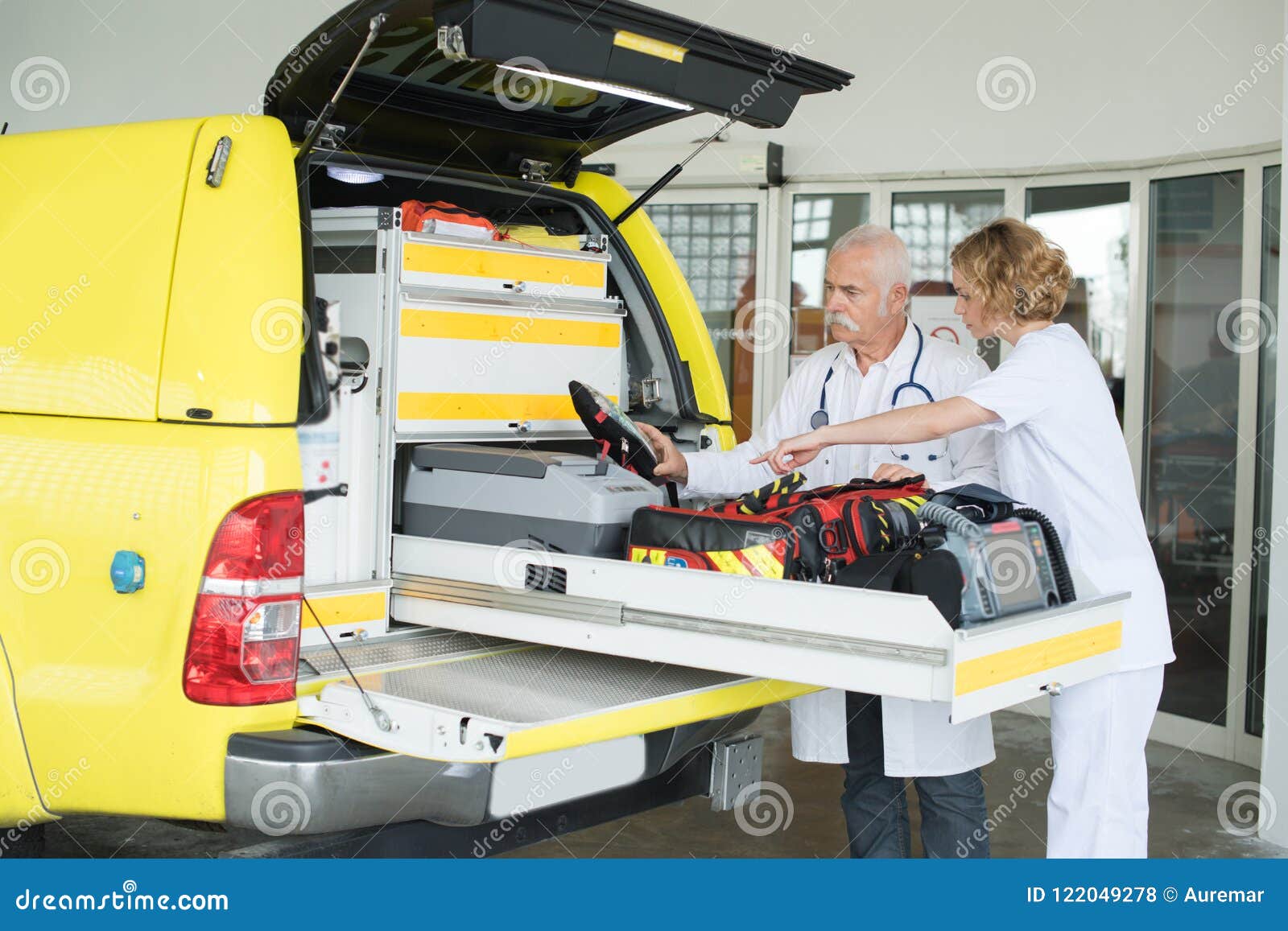 Preparing the Medical Vehicle Stock Photo - Image of paramedic ...