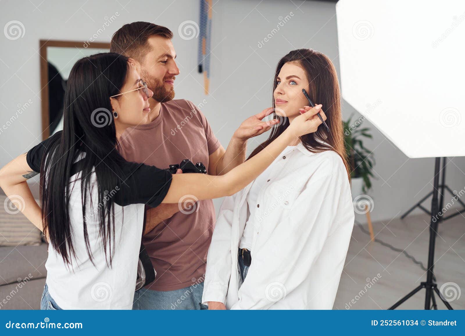 Preparing Model. Photographers Works Indoors in Their Studio at Daytime ...
