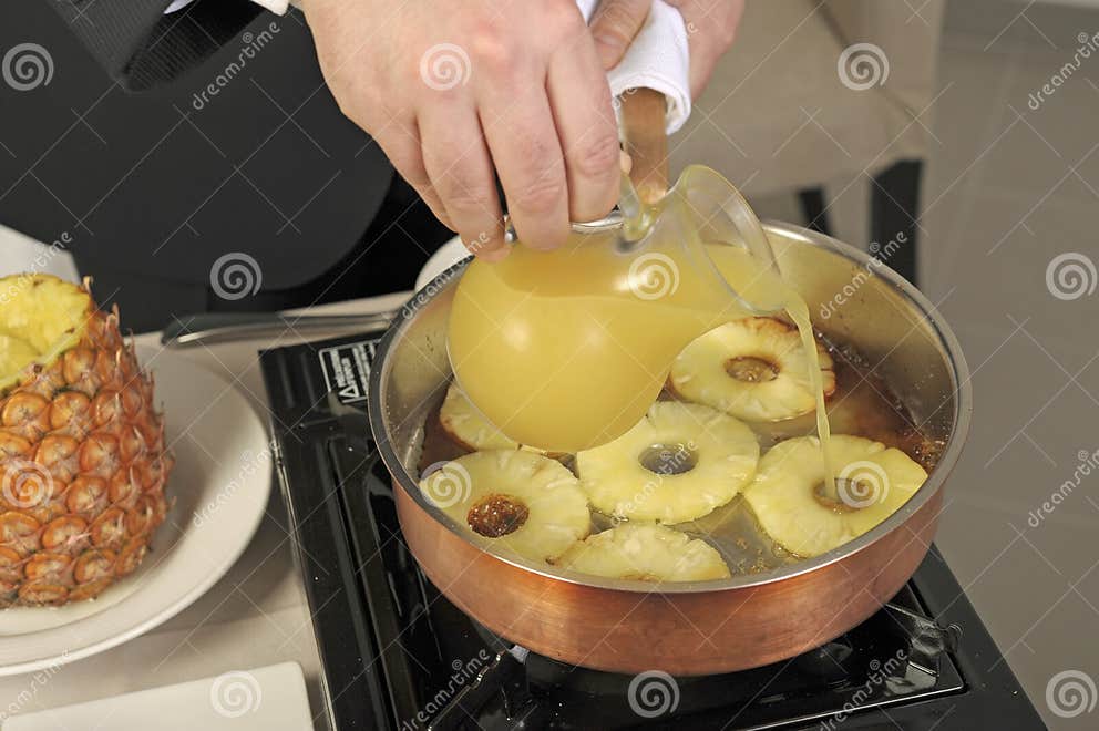 Preparing a Pineapple Flamb Stock Image - Image of indoors, plate: 23708803