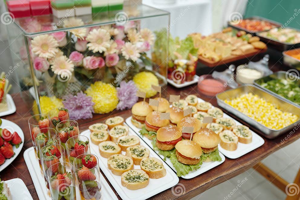 Preparing and Presenting Assorted Buffet Dishes Stock Image - Image of ...