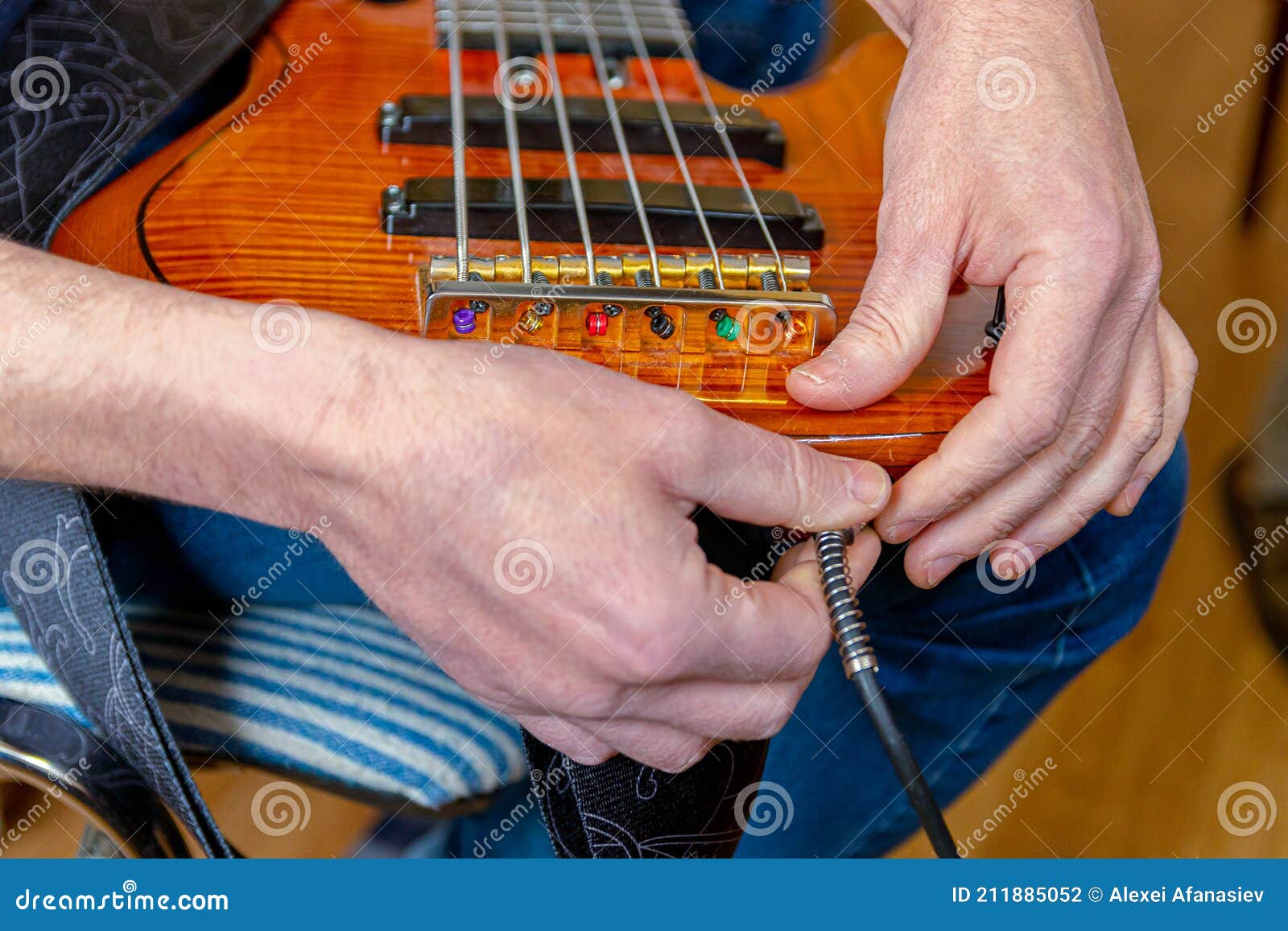 Preparing a Six-string Bass Guitar for Playing Stock Photo - Image of ...