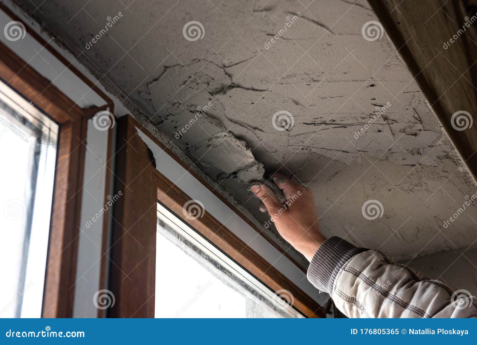 Repair in the Slopes of the Window. the Process of Applying a Layer of ...