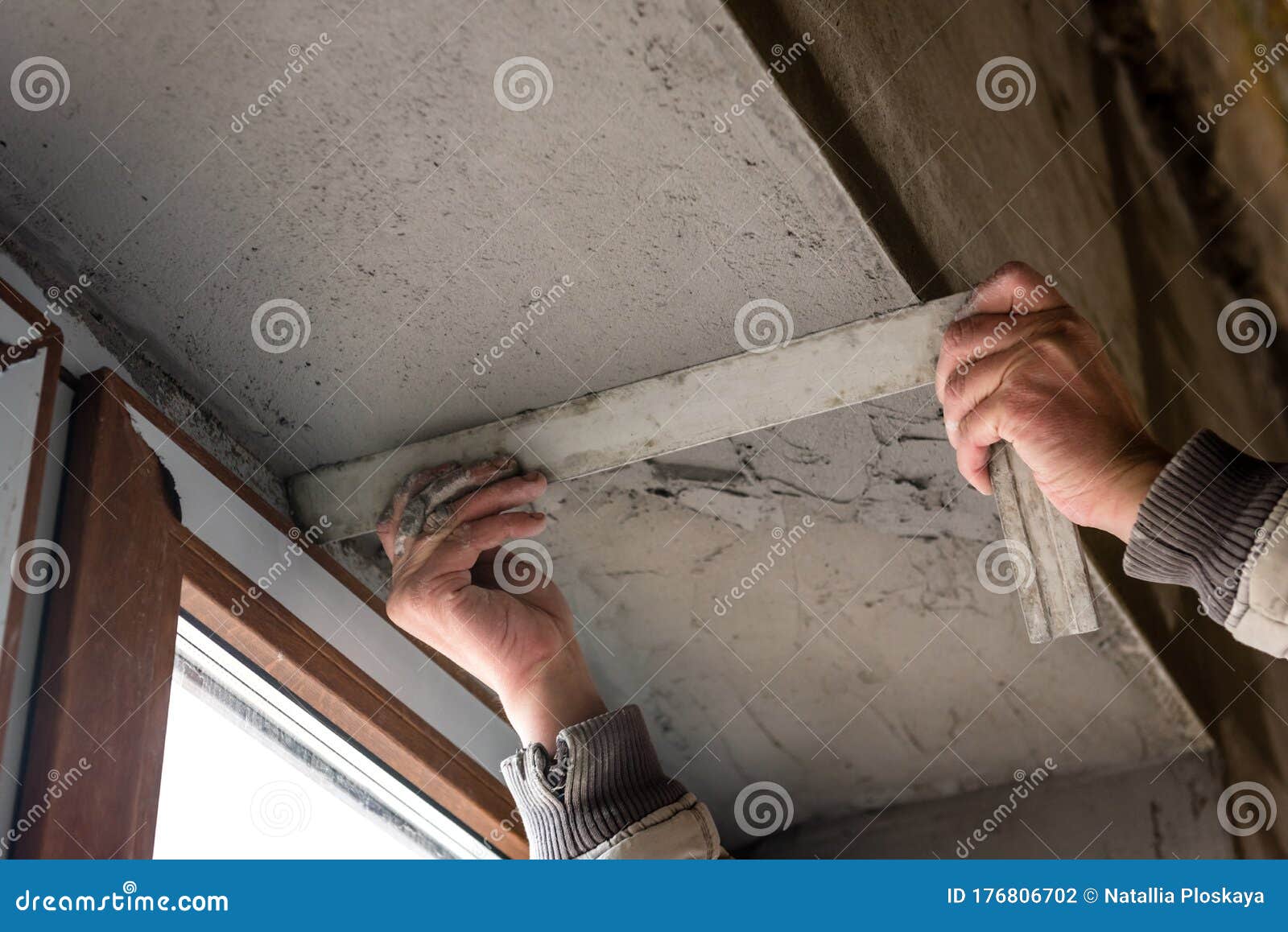 Repair in the Slopes of the Window. the Process of Applying a Layer of ...
