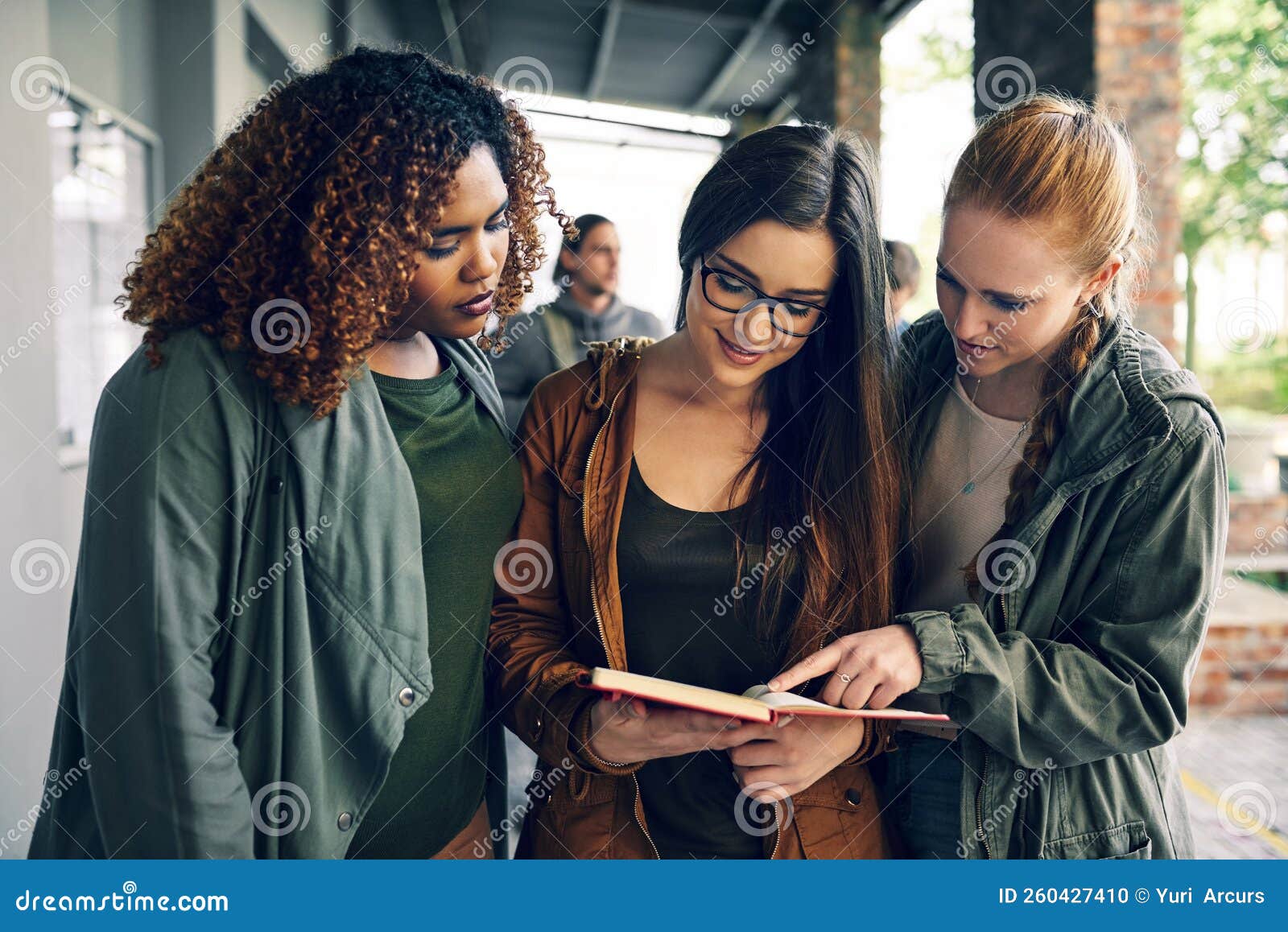 Prepping for Their Next Lecture. a Group of Young Students Reading a ...