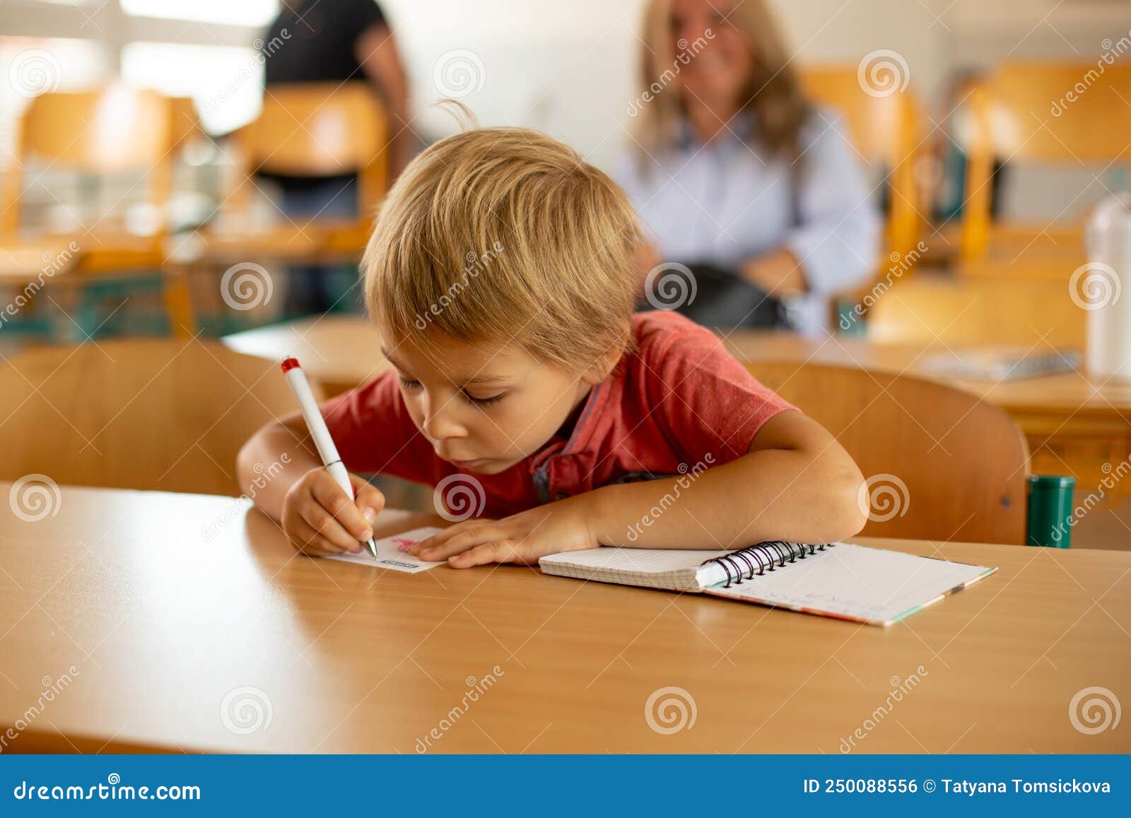 Preschool Child, Sitting on a Desk at School, Having Lesson, Learning ...