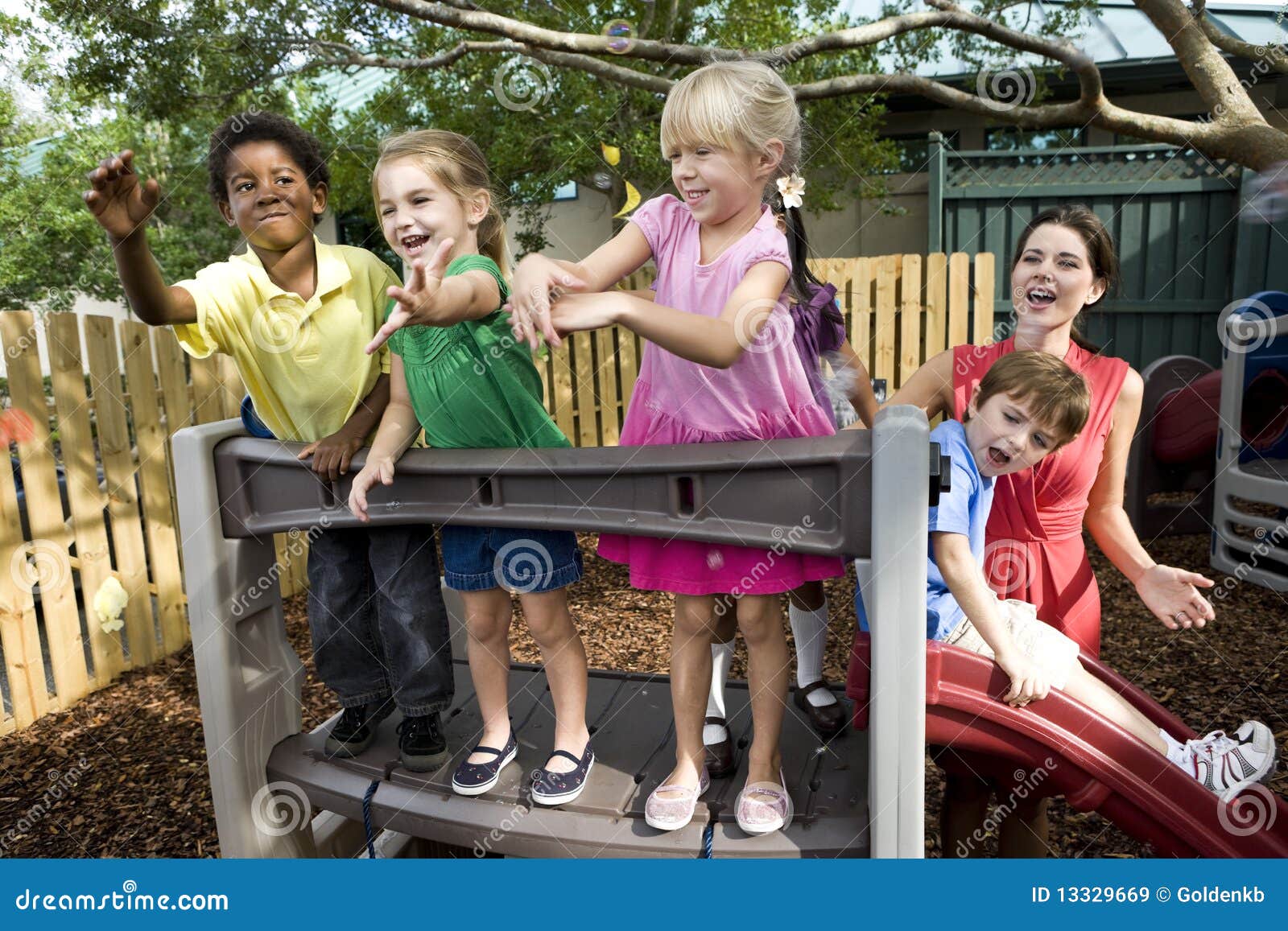 Preschool Children on Playground with Teacher Stock Image - Image of ...