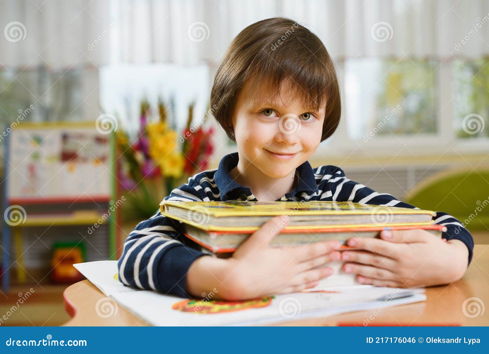 Preschool Smiling Boy Hugging Stack of Books Stock Photo - Image of ...