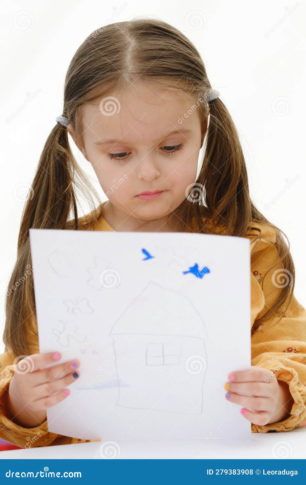 A Preschooler Girl is Looking at a Drawing she Has Drawn. Stock Photo ...