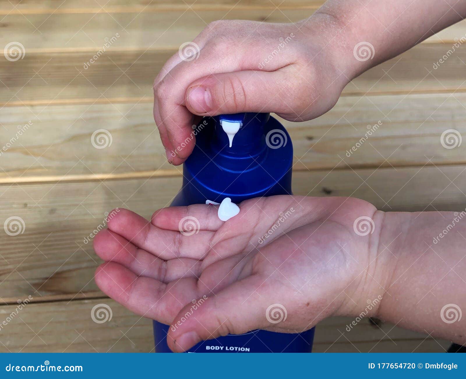 Preschooler Putting on Lotion Stock Photo - Image of putting, young ...