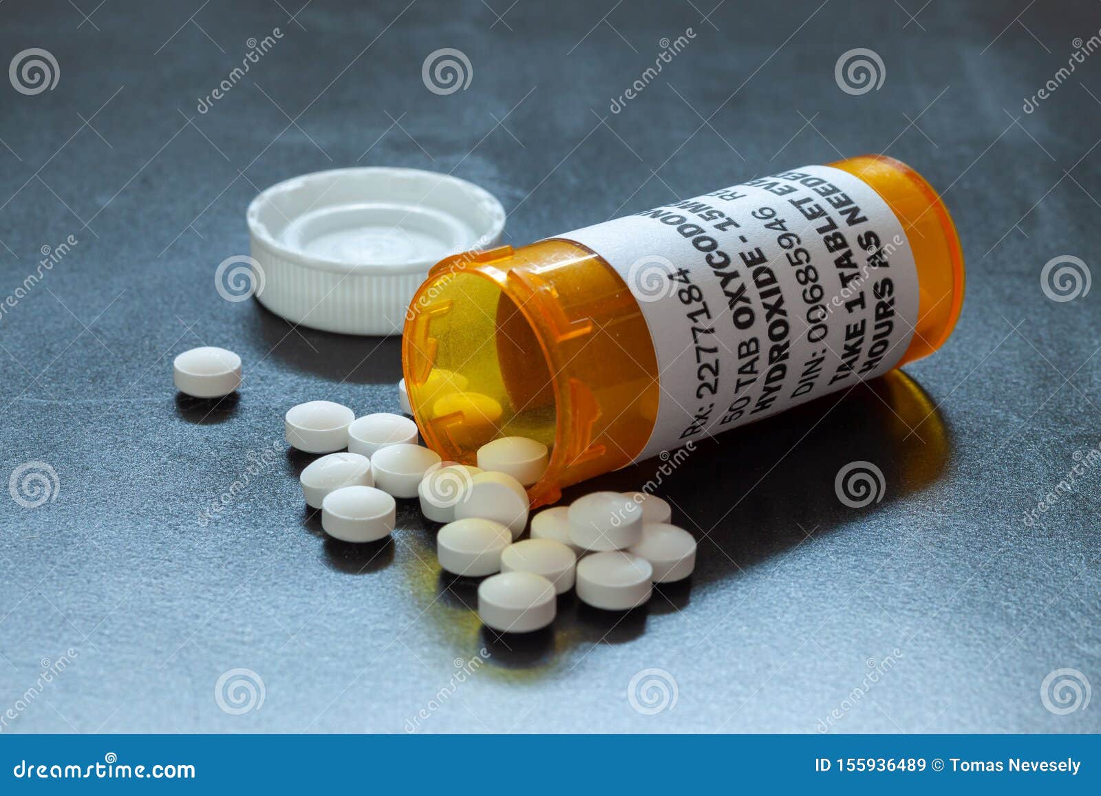 Prescription Bottle with Backlit Oxycodone Tablets. Oxycodone is a ...