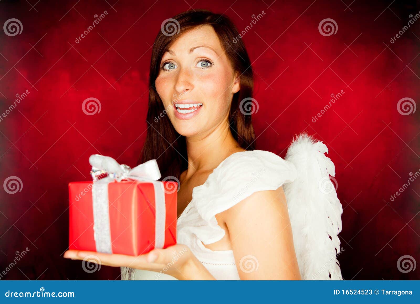 Present angel stock image. Image of christmas, people - 16524523