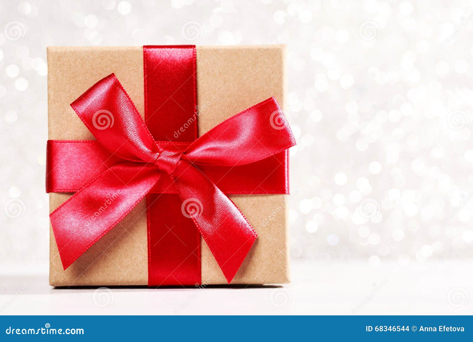 Present box with red bow stock photo. Image of ornament - 68346544