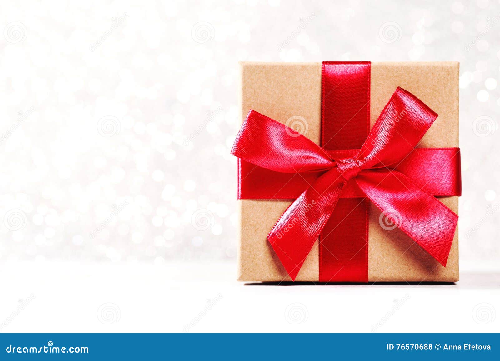 Present box with red bow stock photo. Image of delivery - 76570688