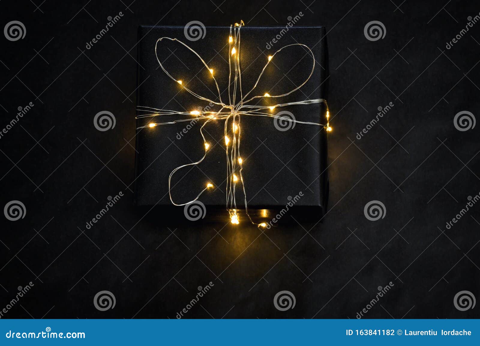 Present Box Wrapped with String Lights Stock Photo - Image of sharing ...