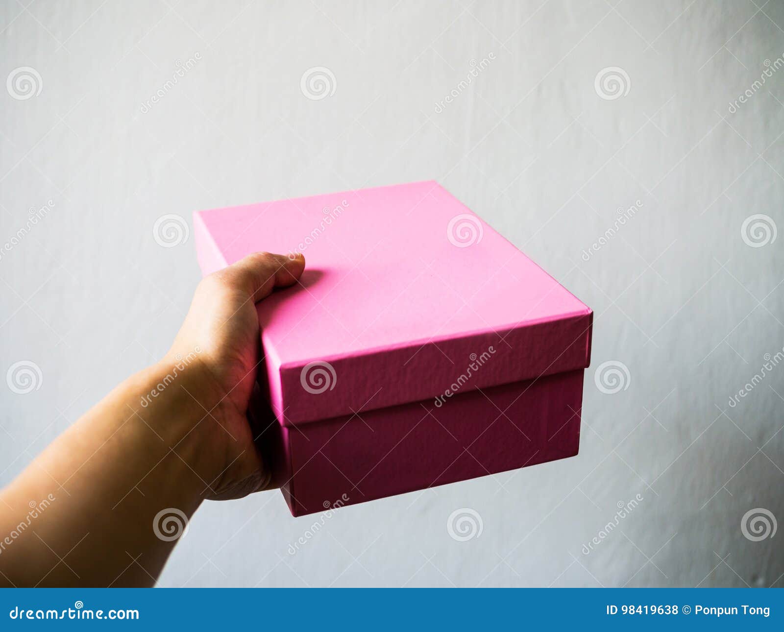 Present or Gift Giving by Hand Stock Photo - Image of grey, christmas ...