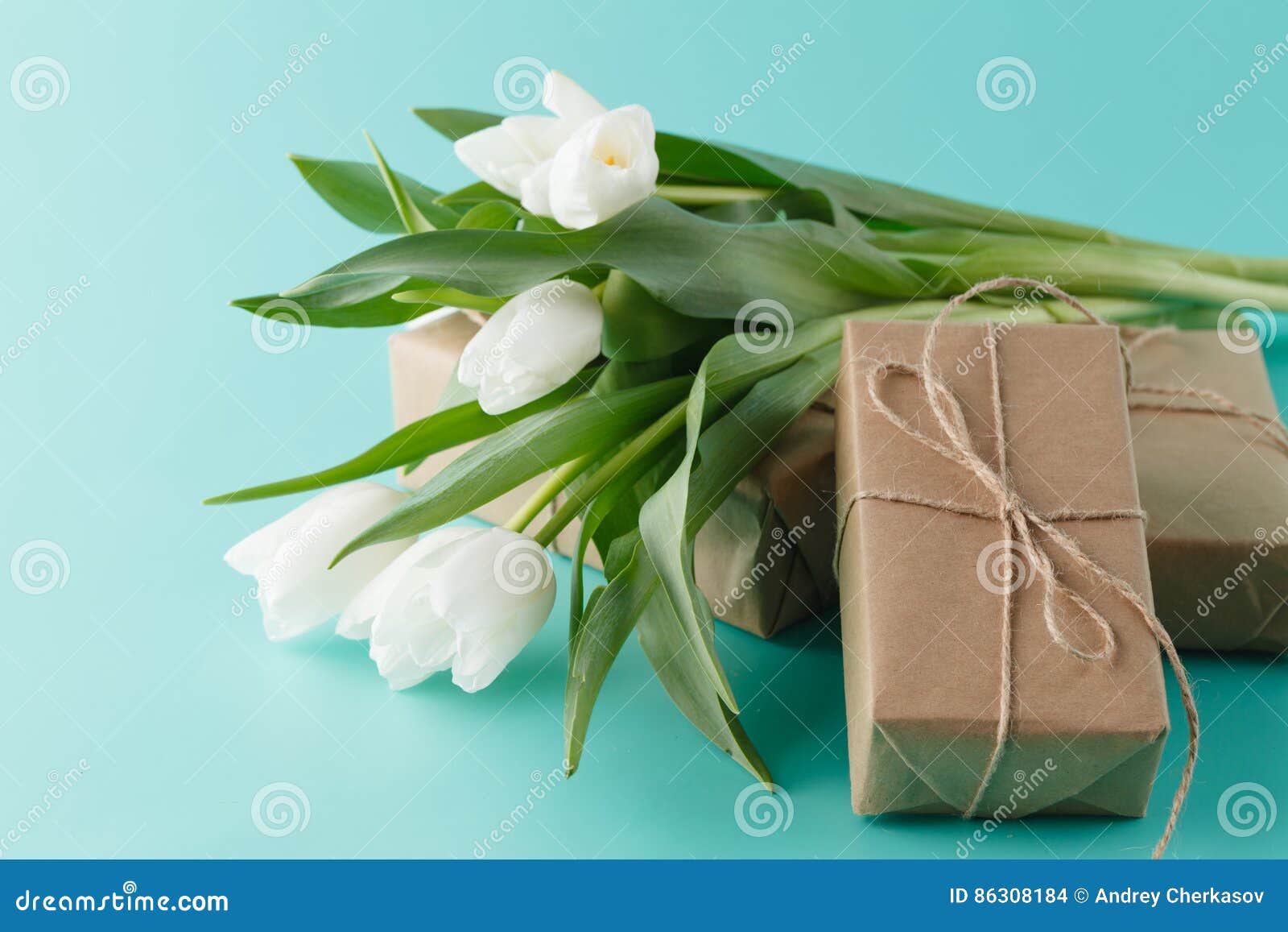 Present of Spring Flowers White Tulips with Gifts Stock Photo - Image ...