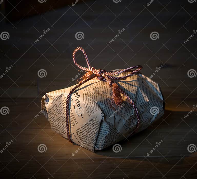 Present Wrapped in Newspaper Stock Image - Image of surface, newspaper ...
