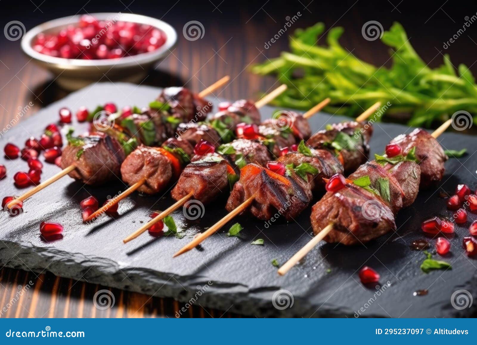 Presentation of Lamb Kebabs and Pomegranate Seeds on a Slate Board ...