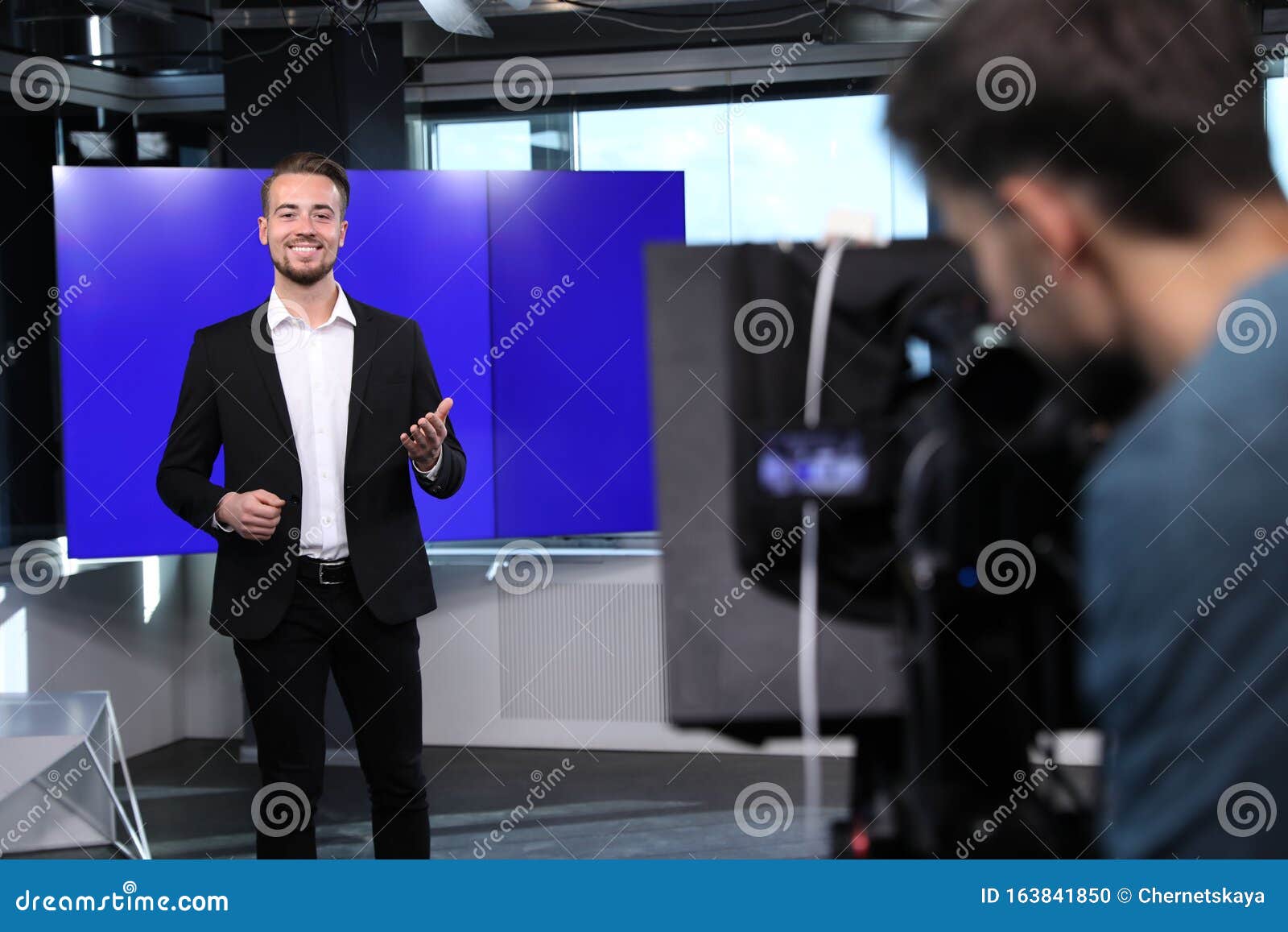 Presenter and Video Camera Operator Working. News Broadcasting Stock ...