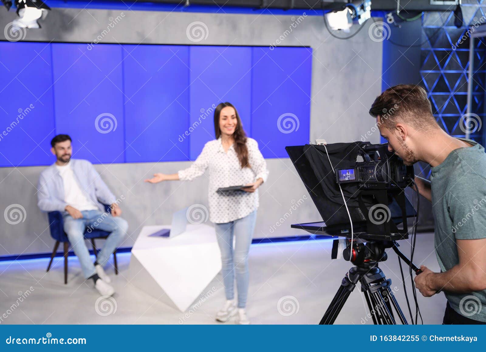 Presenters and Video Camera Operator Working. News Broadcasting Stock ...