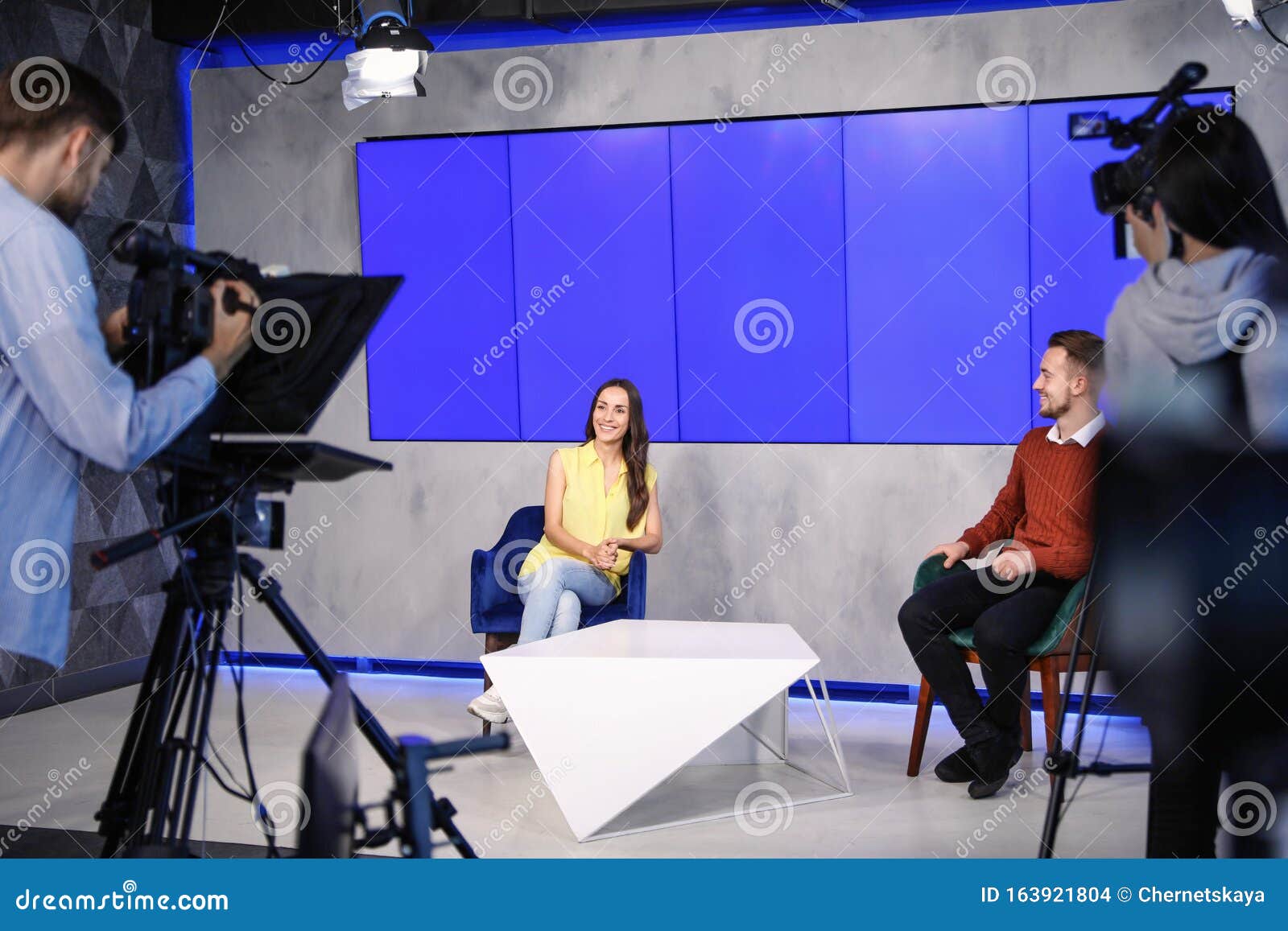 Presenters and Video Camera Operator Working. News Broadcasting Stock ...