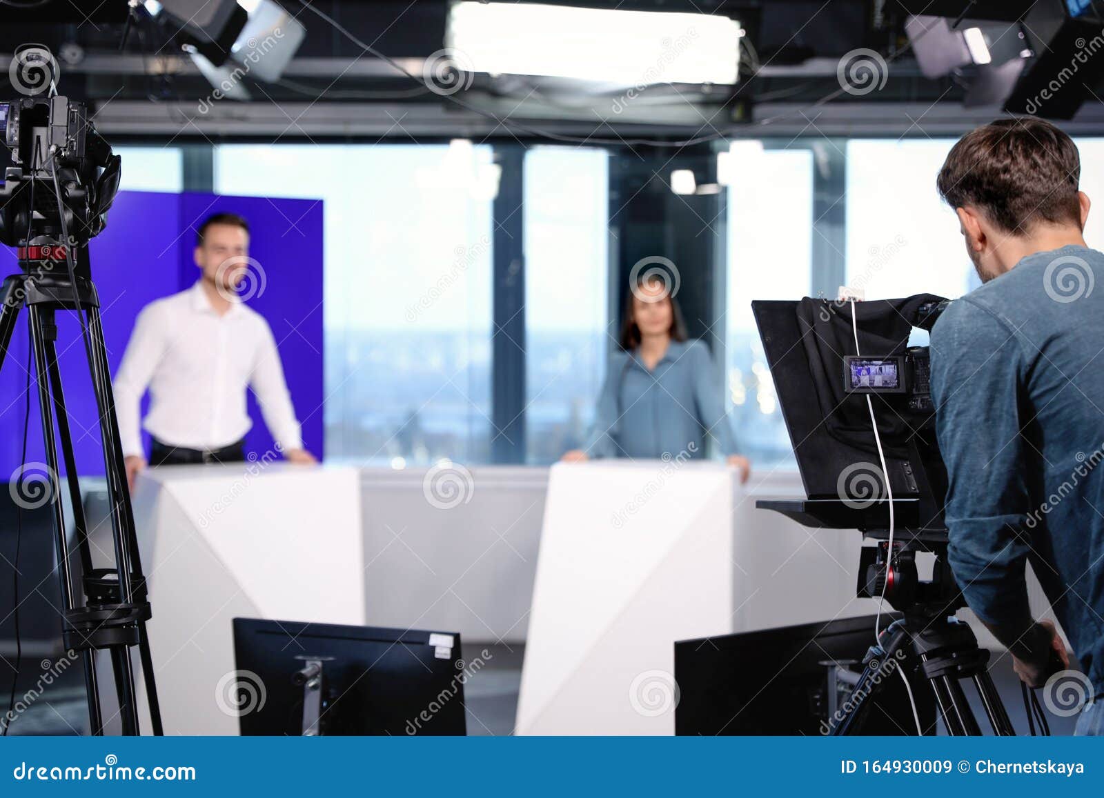 Presenters and Video Camera Operator Working. News Broadcasting Stock ...
