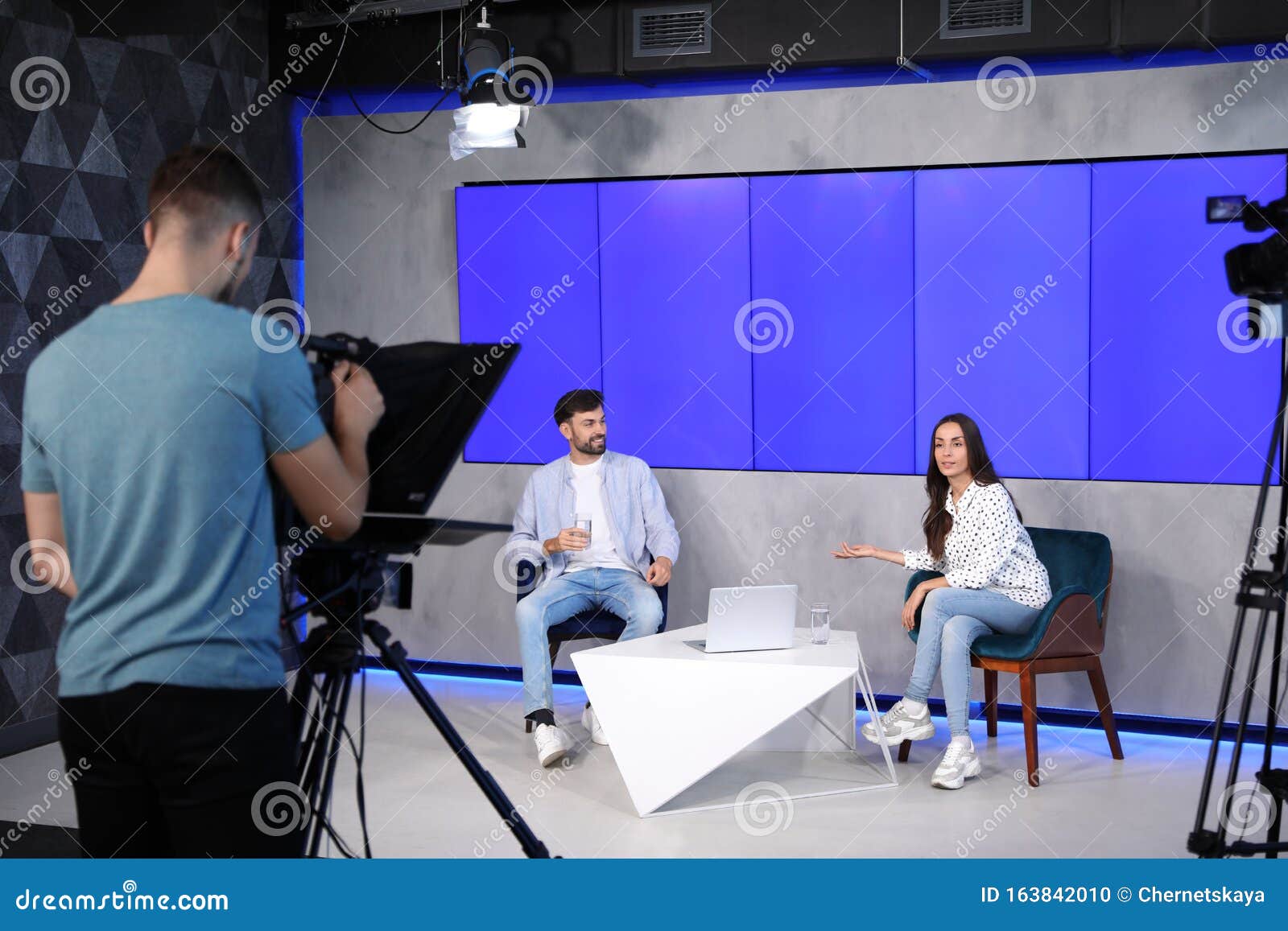 Presenters and Video Camera Operator Working. News Broadcasting Stock ...