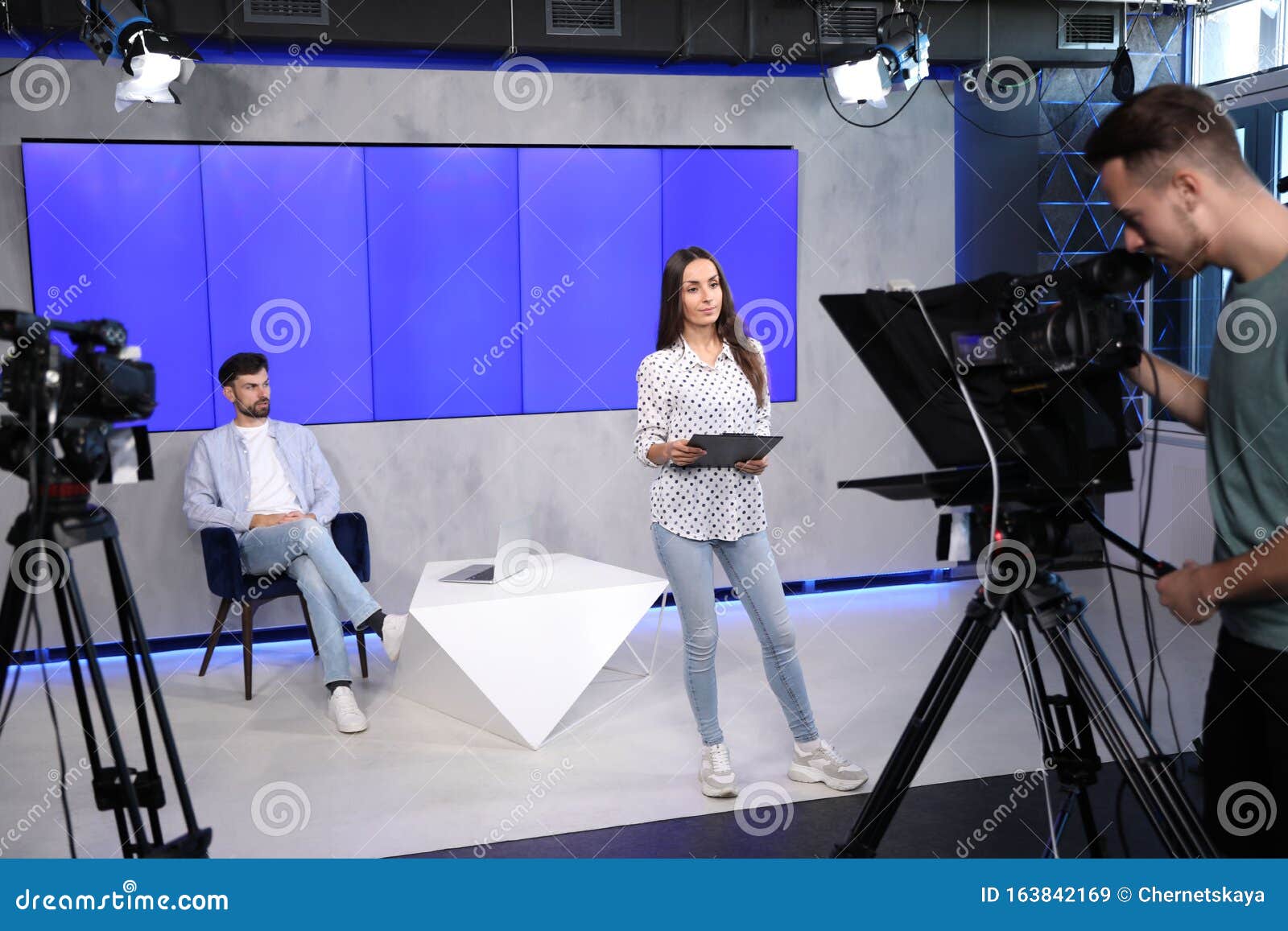 Presenters and Video Camera Operator Working. News Broadcasting Stock ...