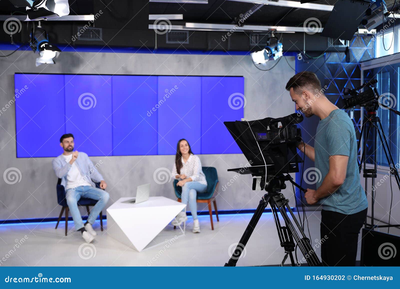 Presenters and Video Camera Operator Working. News Broadcasting Stock ...