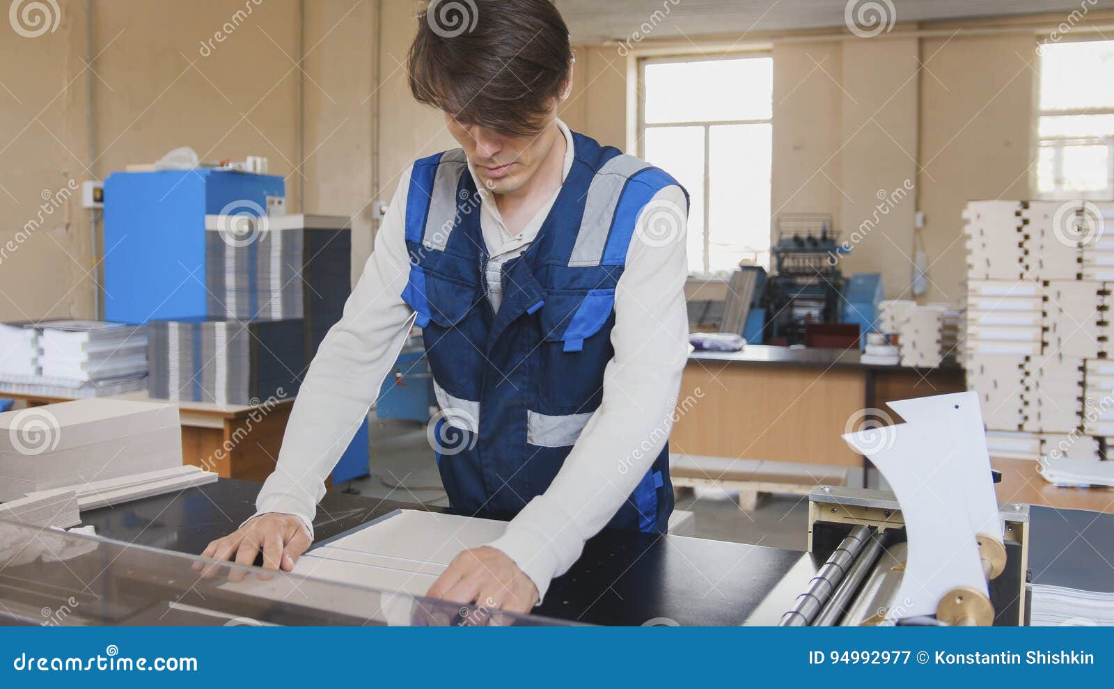 Press Operator Over a Clean Sheet of Paper Stock Image - Image of ...