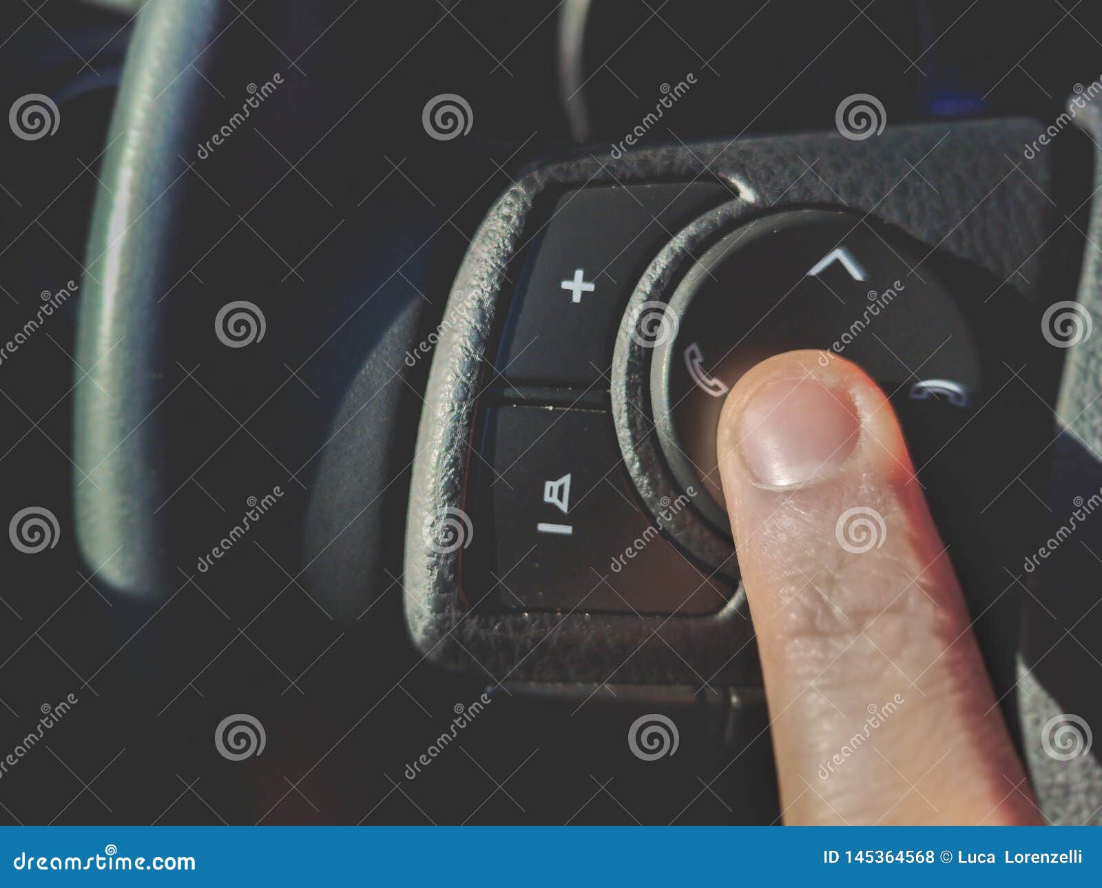 Press Phone and Volume Button Controls on Steering Wheel in Modern Car ...