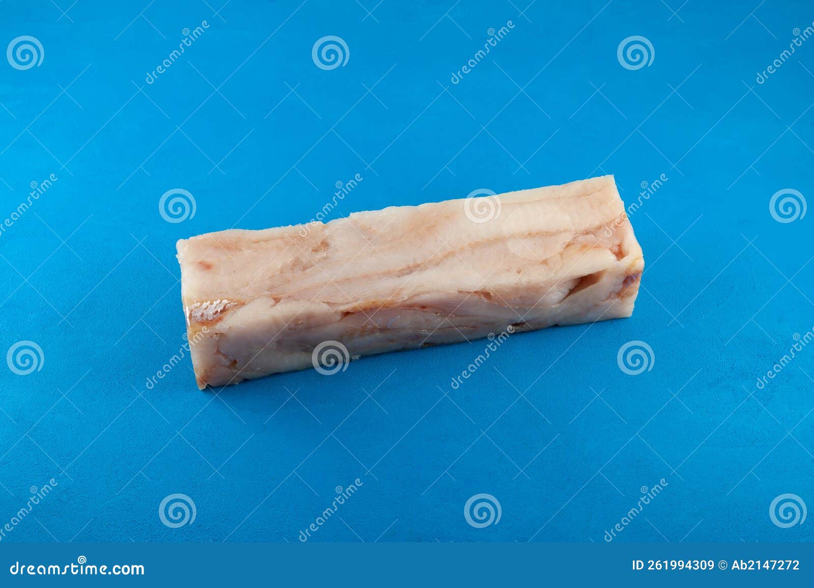 Pressed Frozen Fish Fillet on Blue Background. Proper Slow Defrosting ...